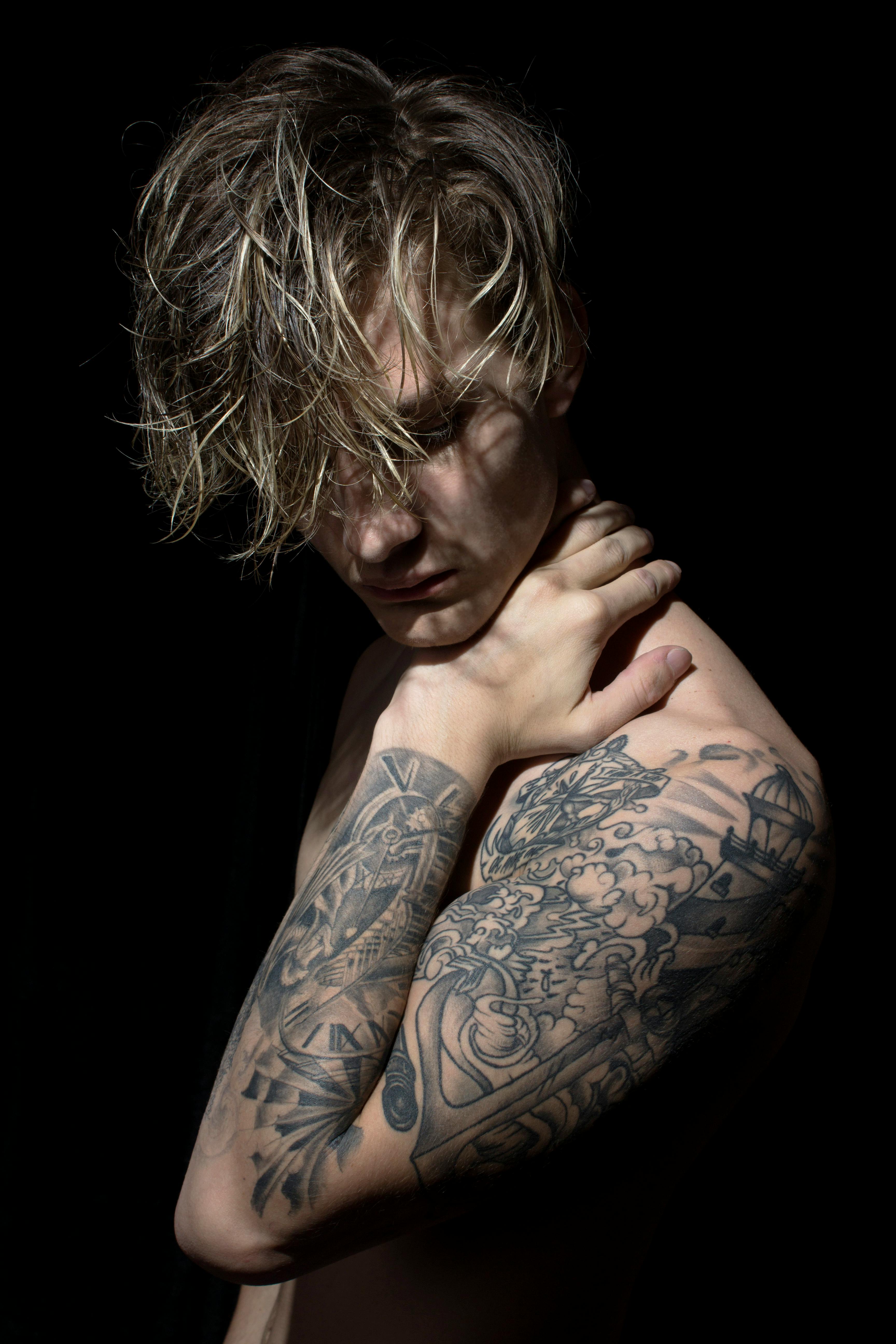 Shirtless Man Bowing Down with Hands Behind Back · Free Stock Photo