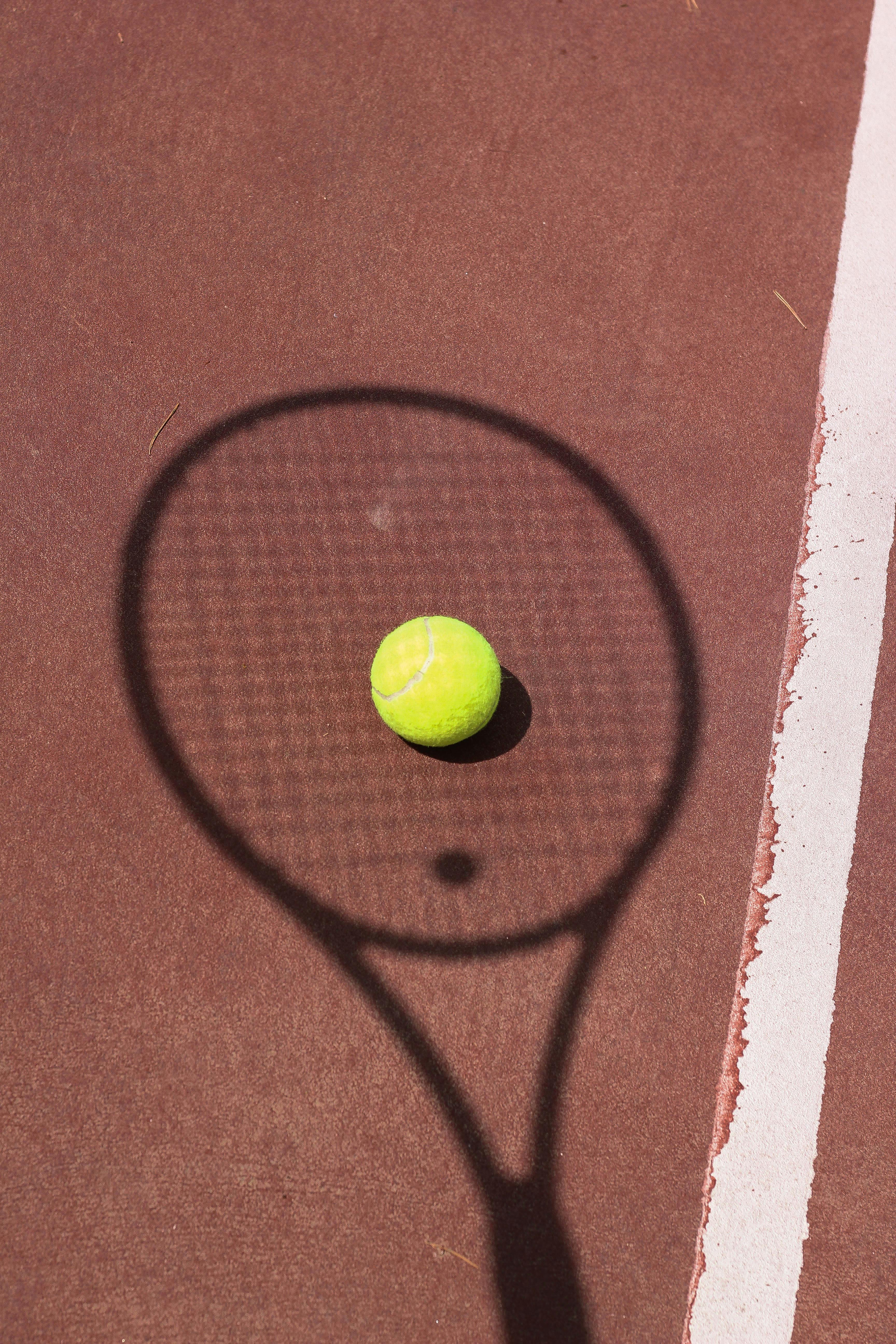 Shadow of a Tennis Racket on a Tennis Court · Free Stock Photo