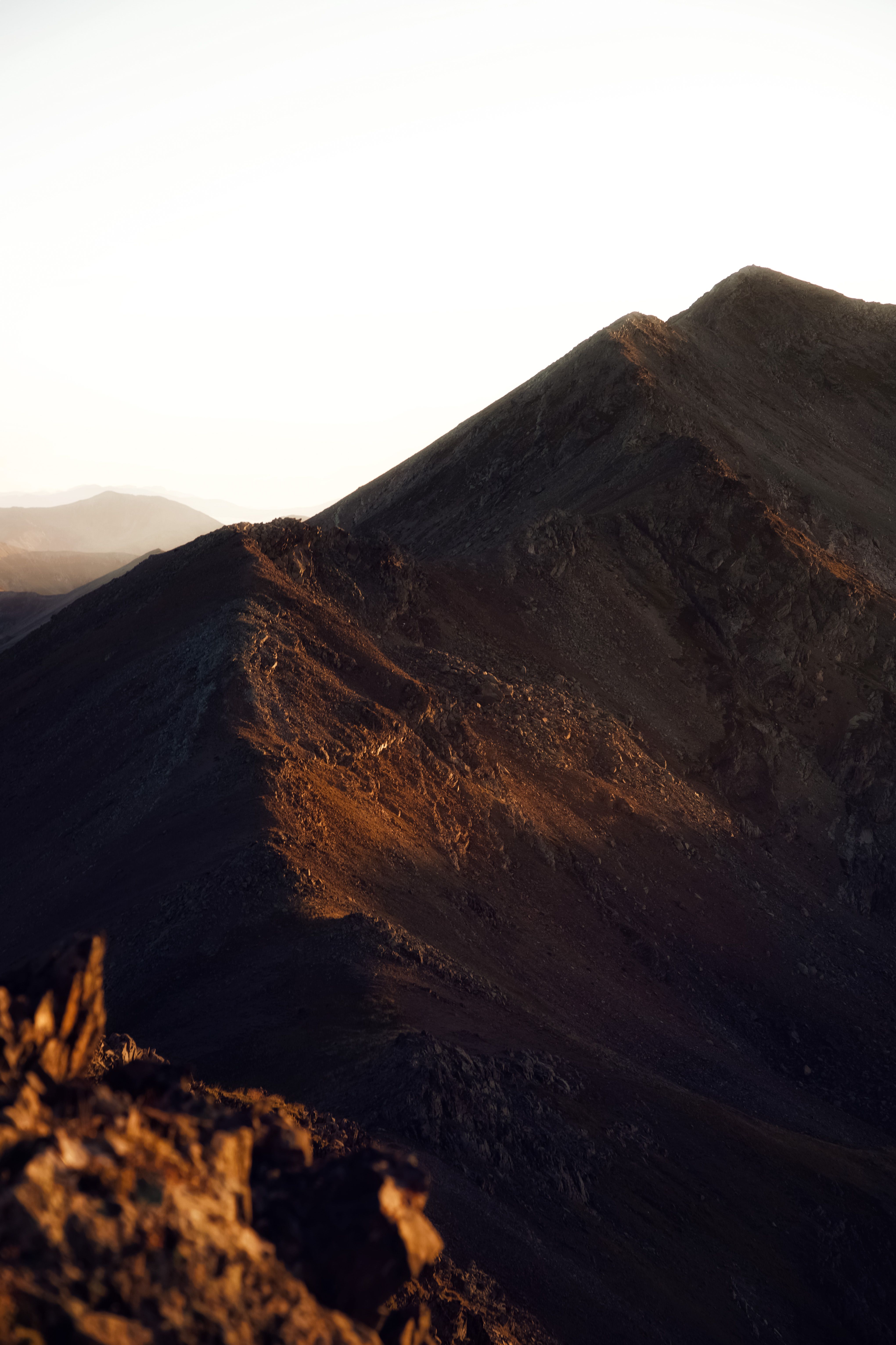 Scenic landscape of rocky cliffs surrounding lake at sunset · Free ...