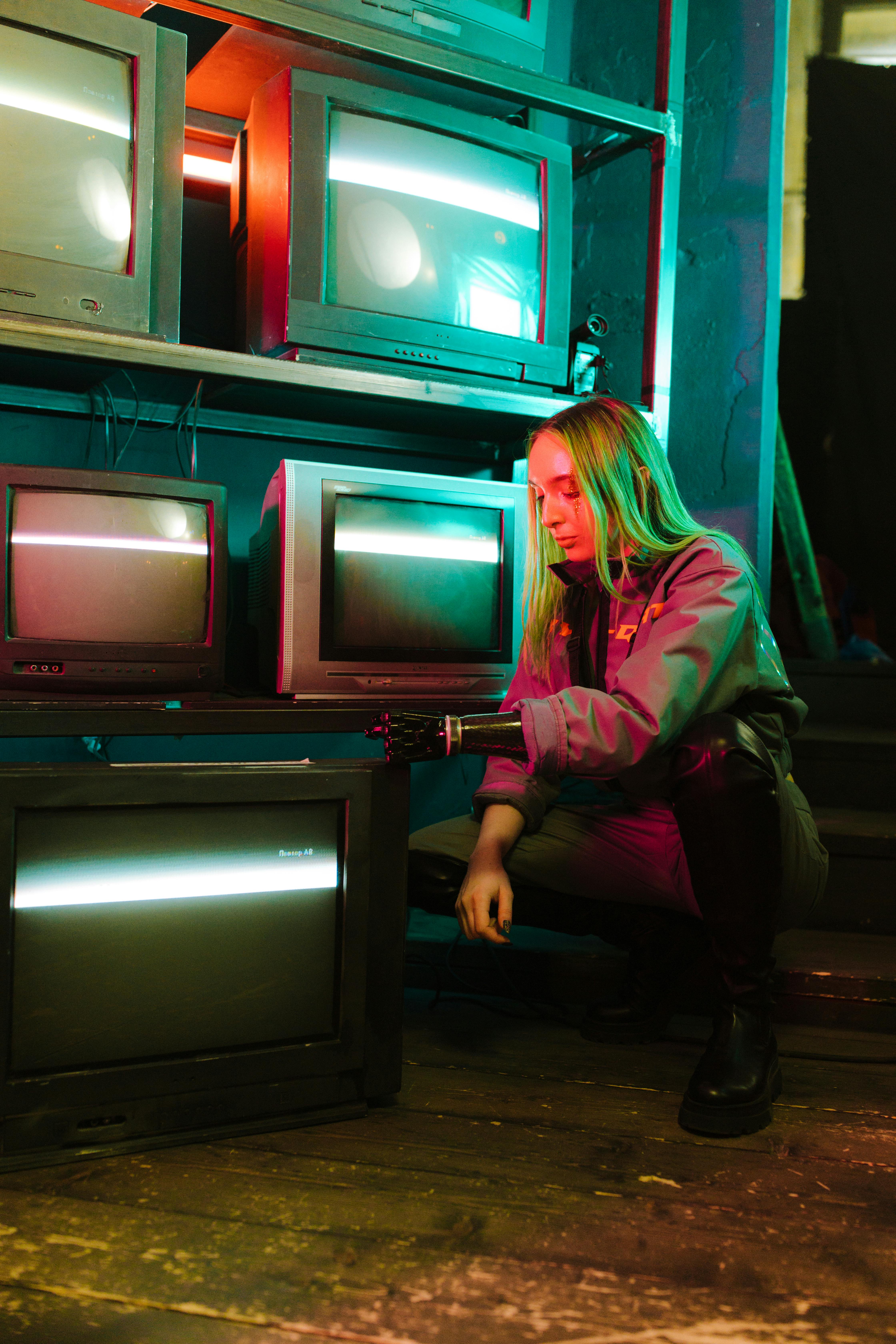 A Woman Holding a Tv · Free Stock Photo