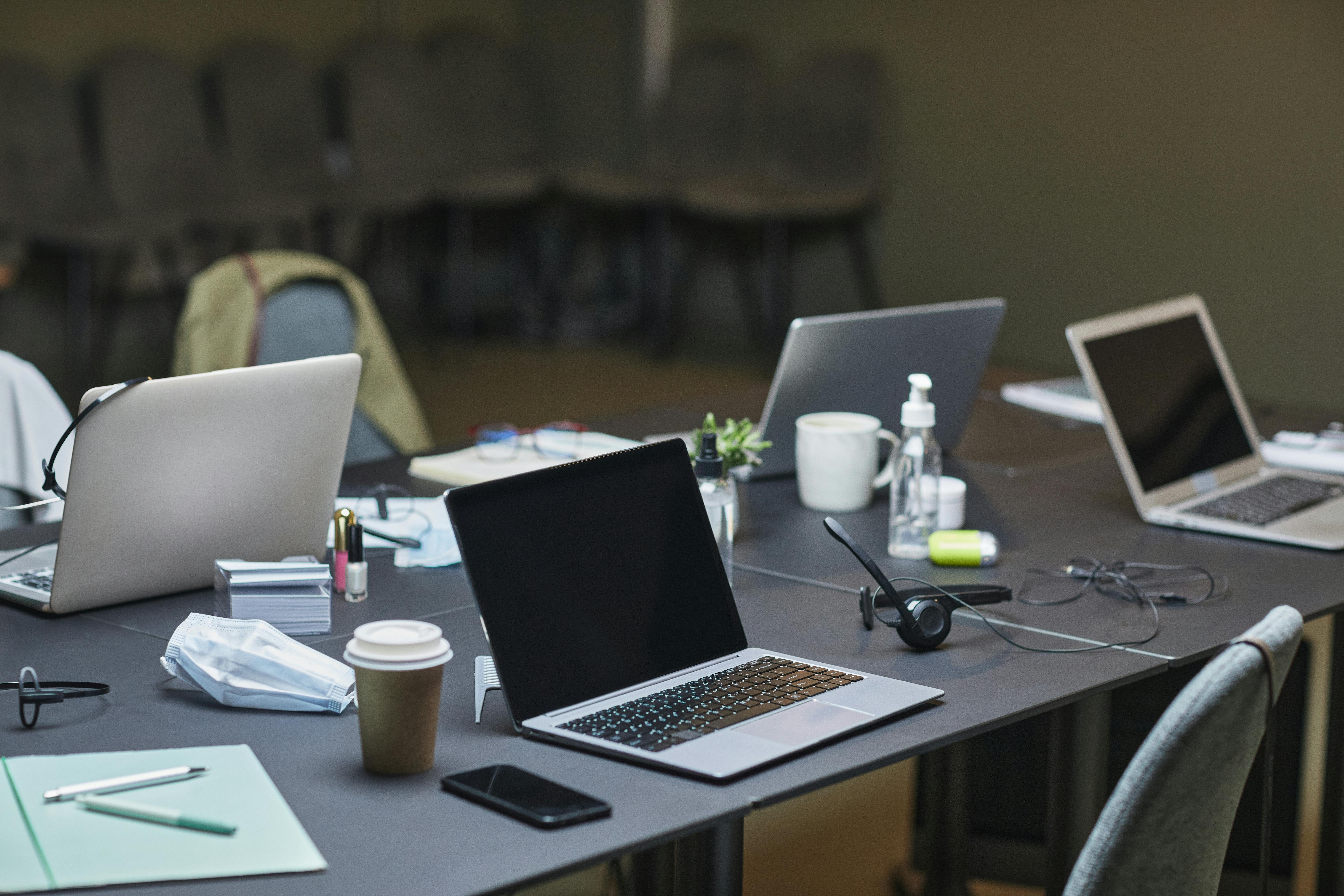 Laptops on Desks in an Office · Free Stock Photo