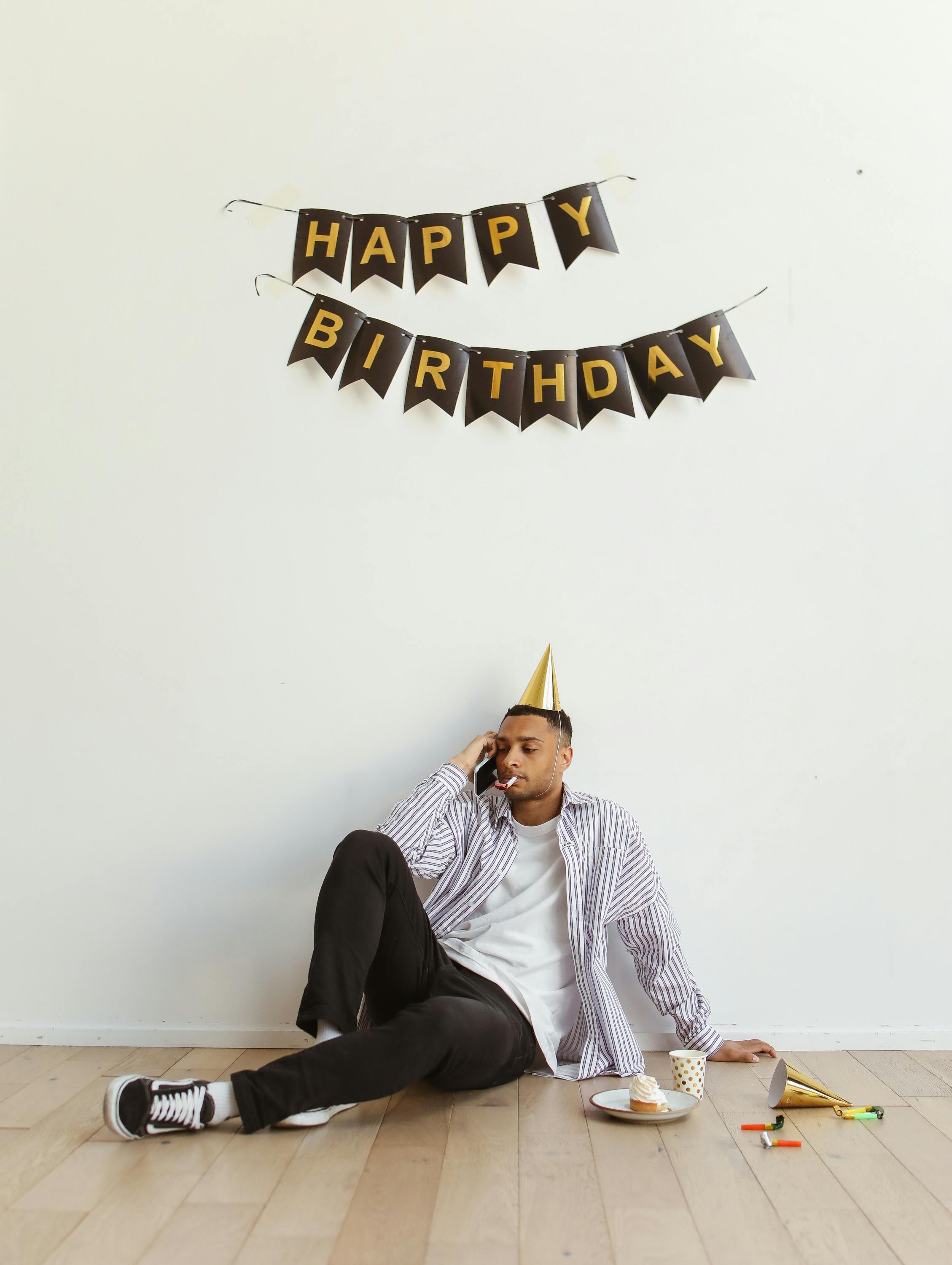 Man Spending Birthday Alone with Phone in Hand · Free Stock Photo