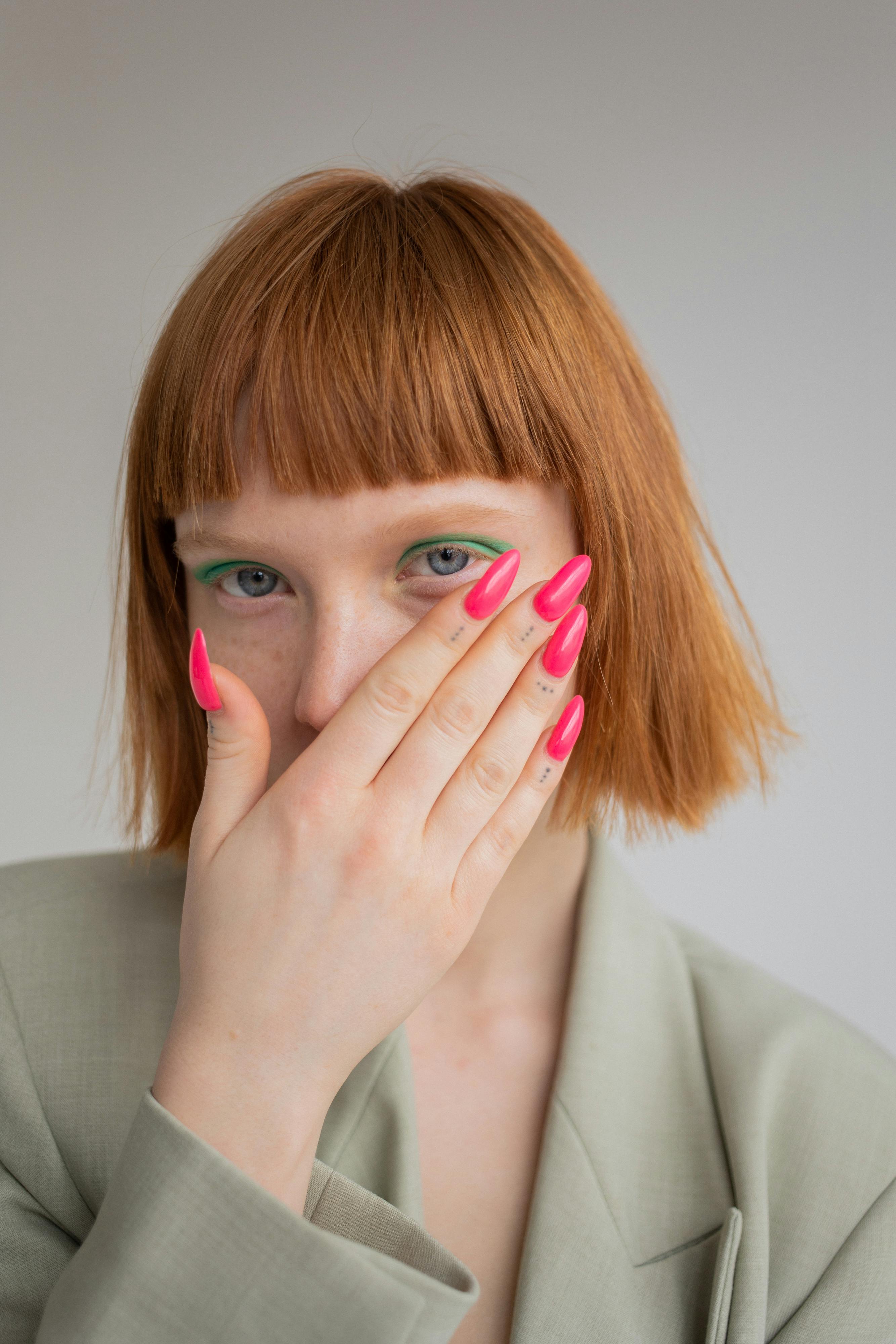 Stylish woman with makeup covering face · Free Stock Photo
