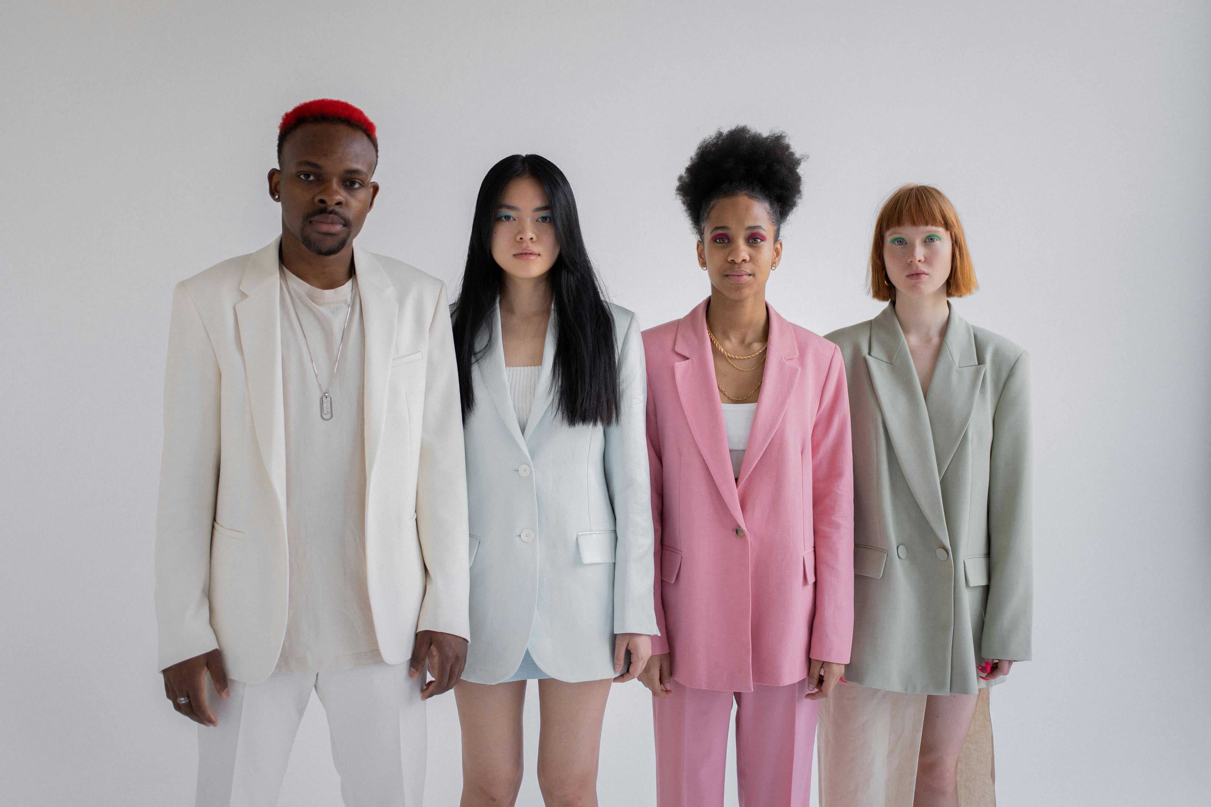 Multiracial models in trendy clothes in studio · Free Stock Photo