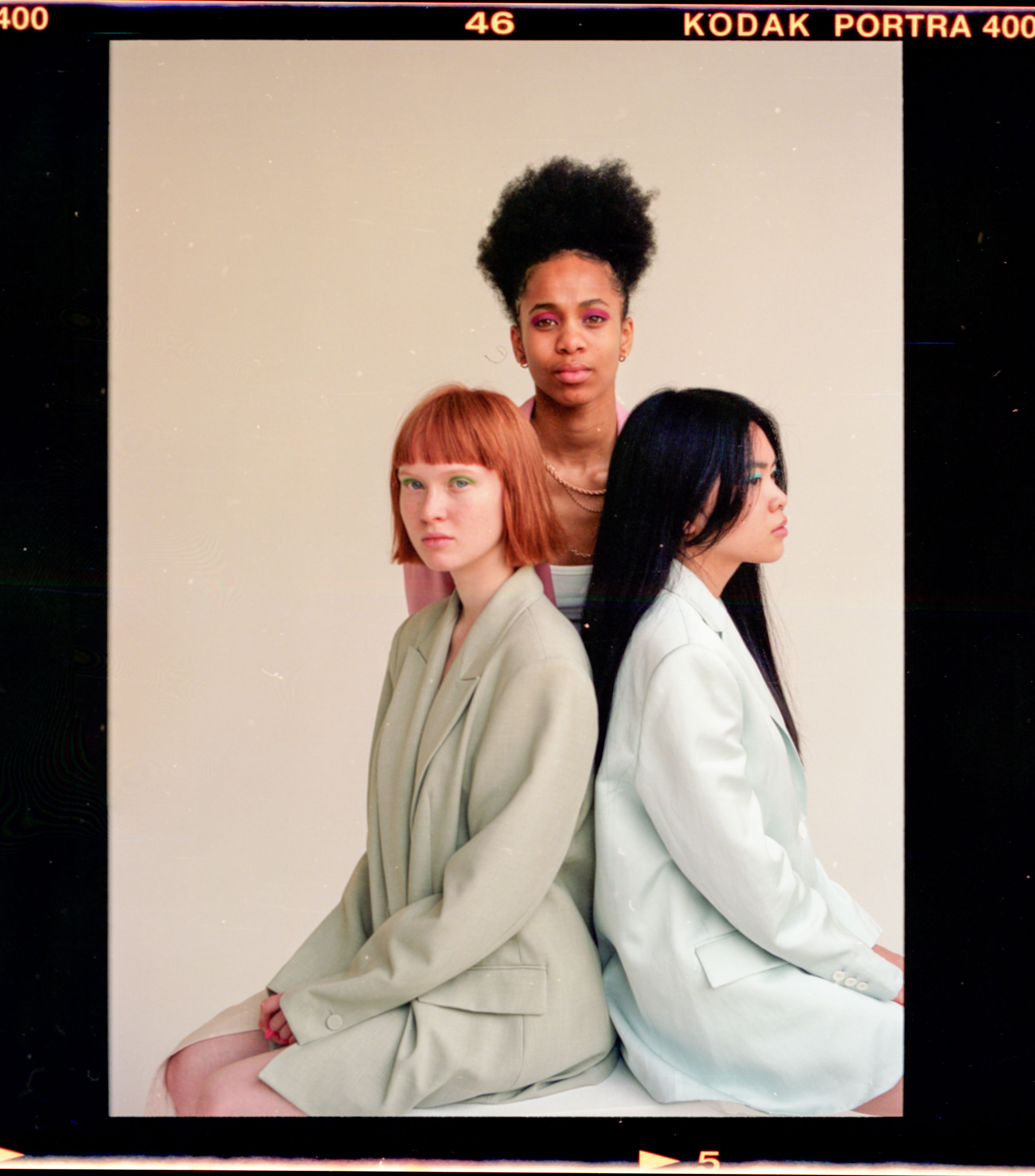 Multiracial models in trendy clothes in studio · Free Stock Photo