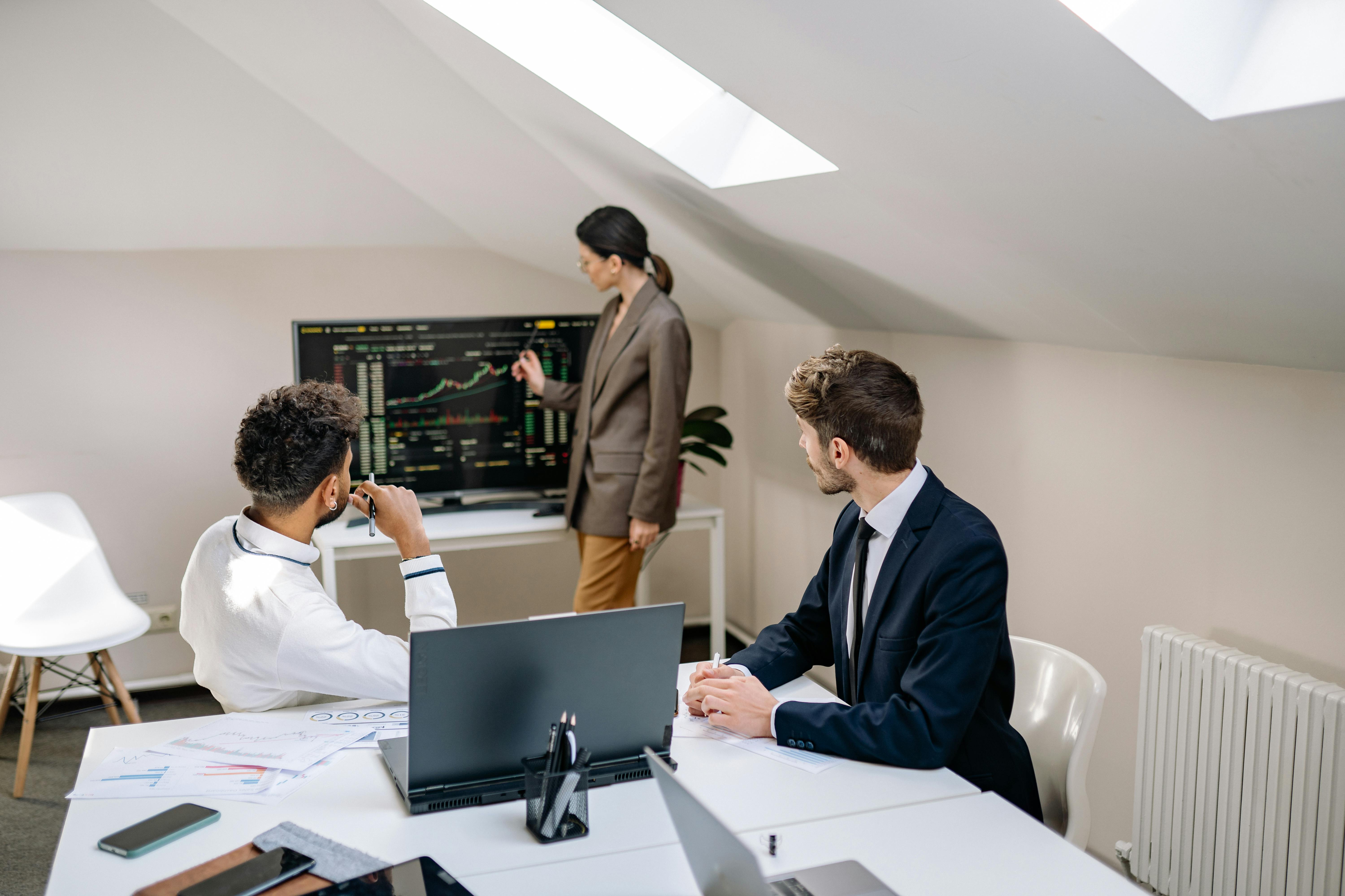 Man and Woman Presenting at Work · Free Stock Photo