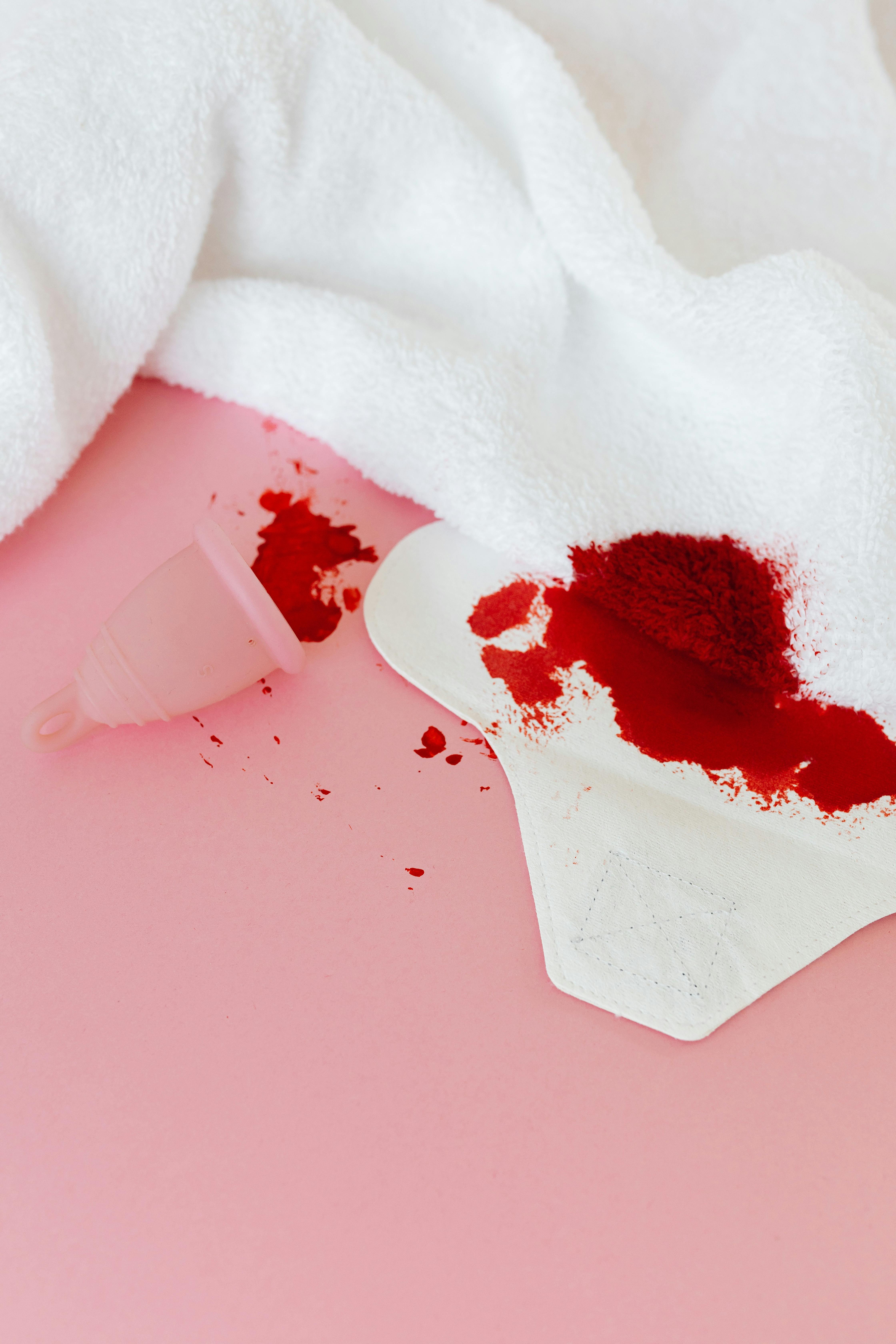 Person Throwing a Tampon in a Trash Bin · Free Stock Photo