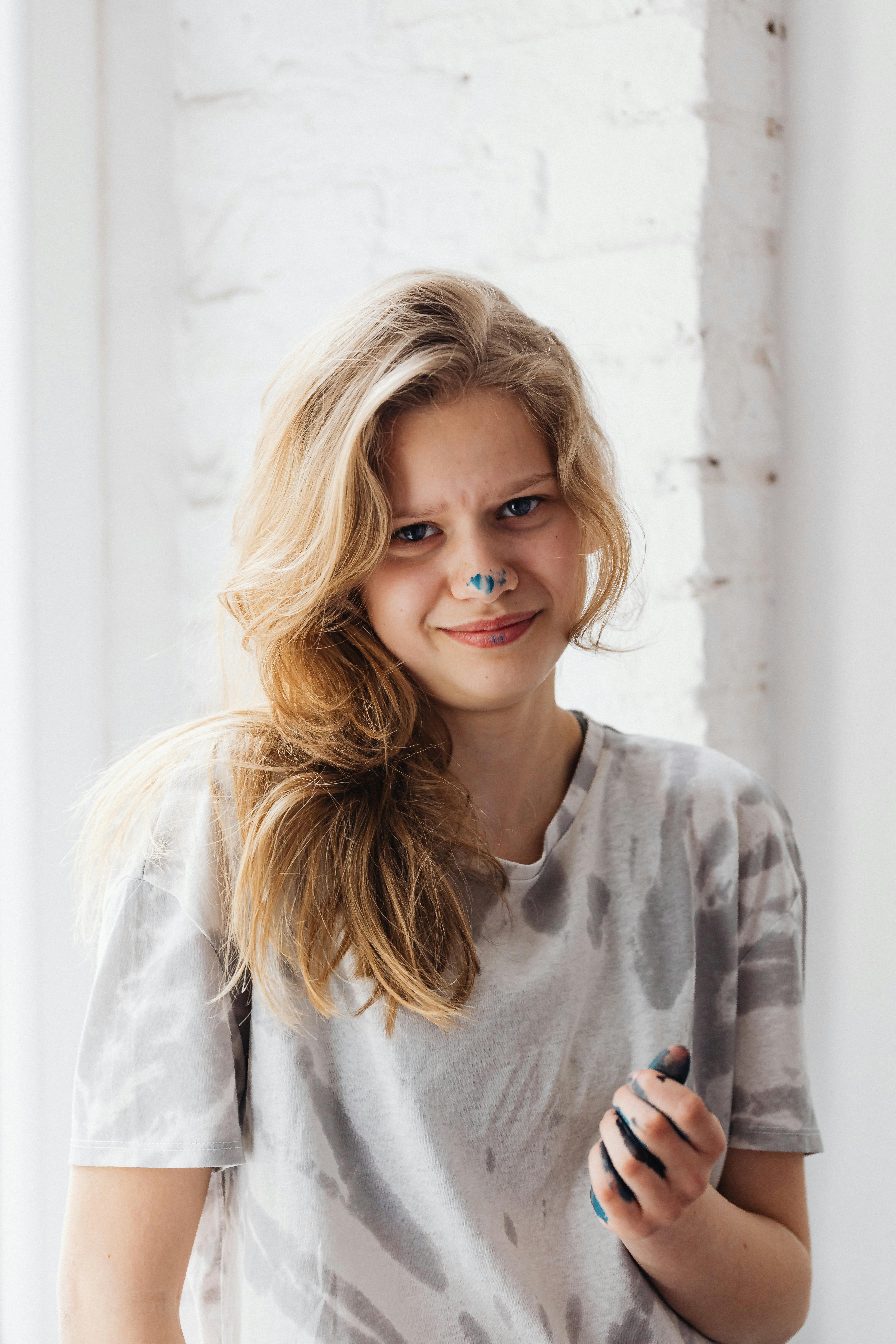 Woman Tousling her Blonde Hair · Free Stock Photo
