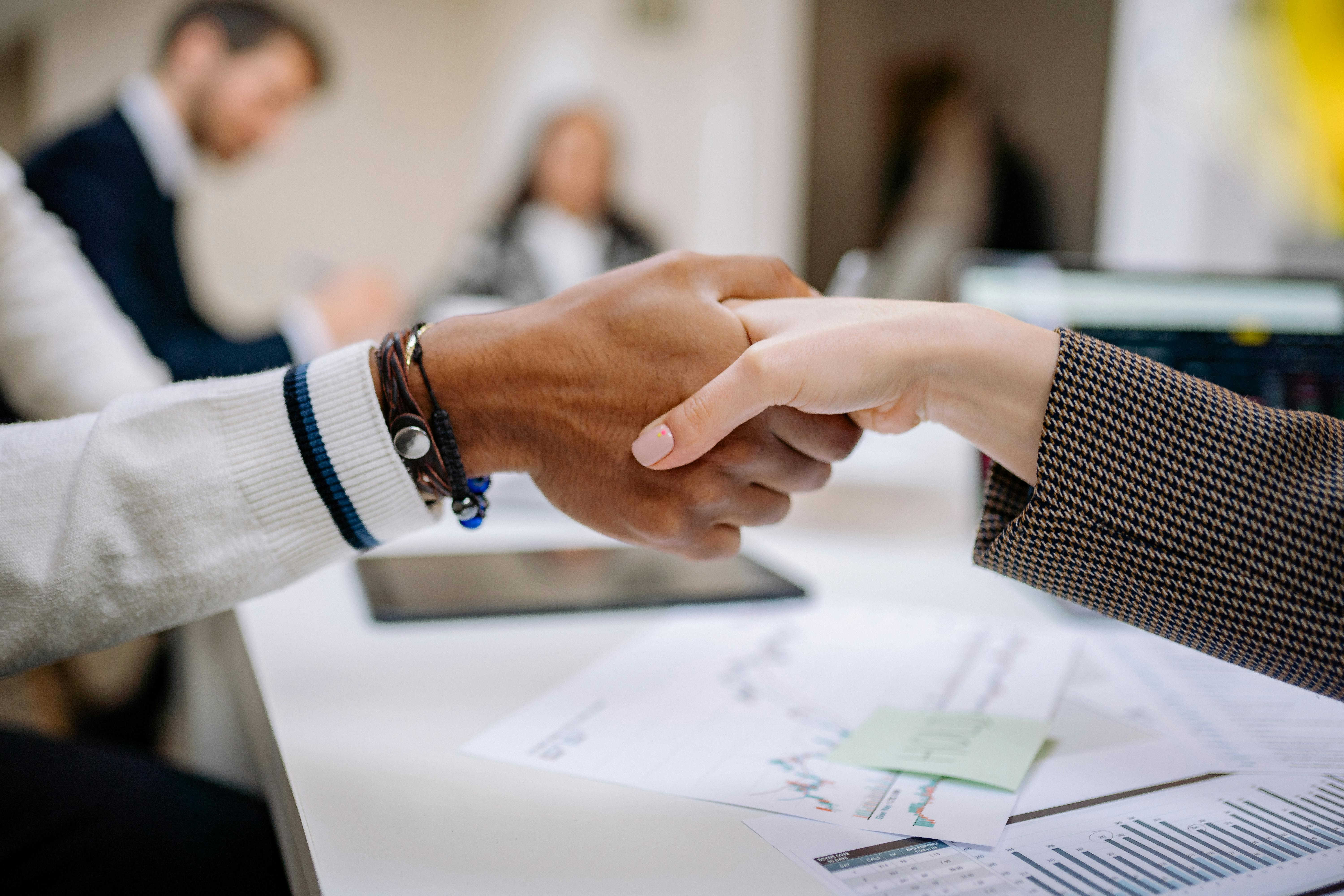 Close-up Photo of Two People doing Handshake · Free Stock Photo