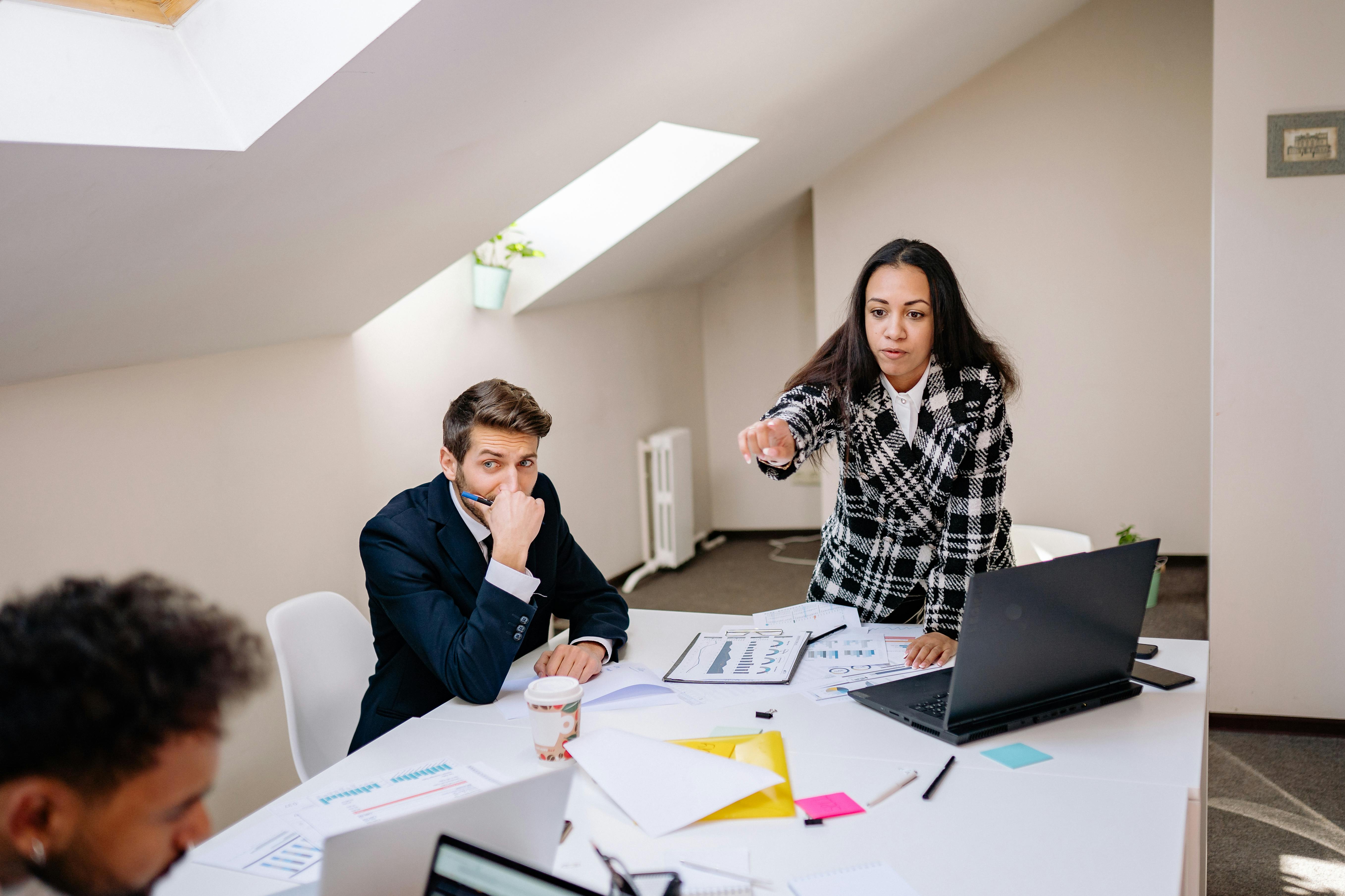 A Person Pointing on the White Printer Paper · Free Stock Photo