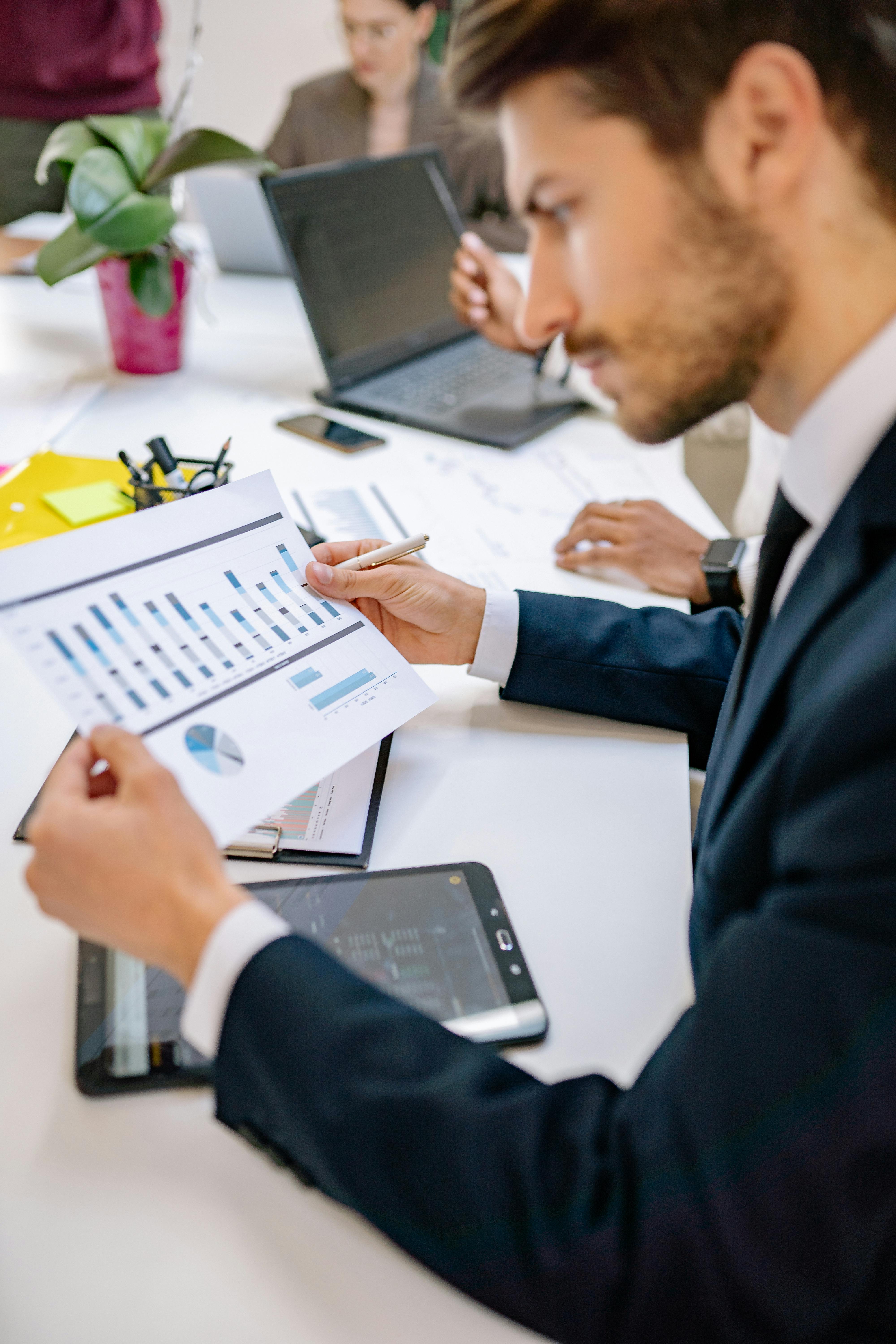 Man Looking Charts And Graphs Photos, Download The BEST Free Man ...