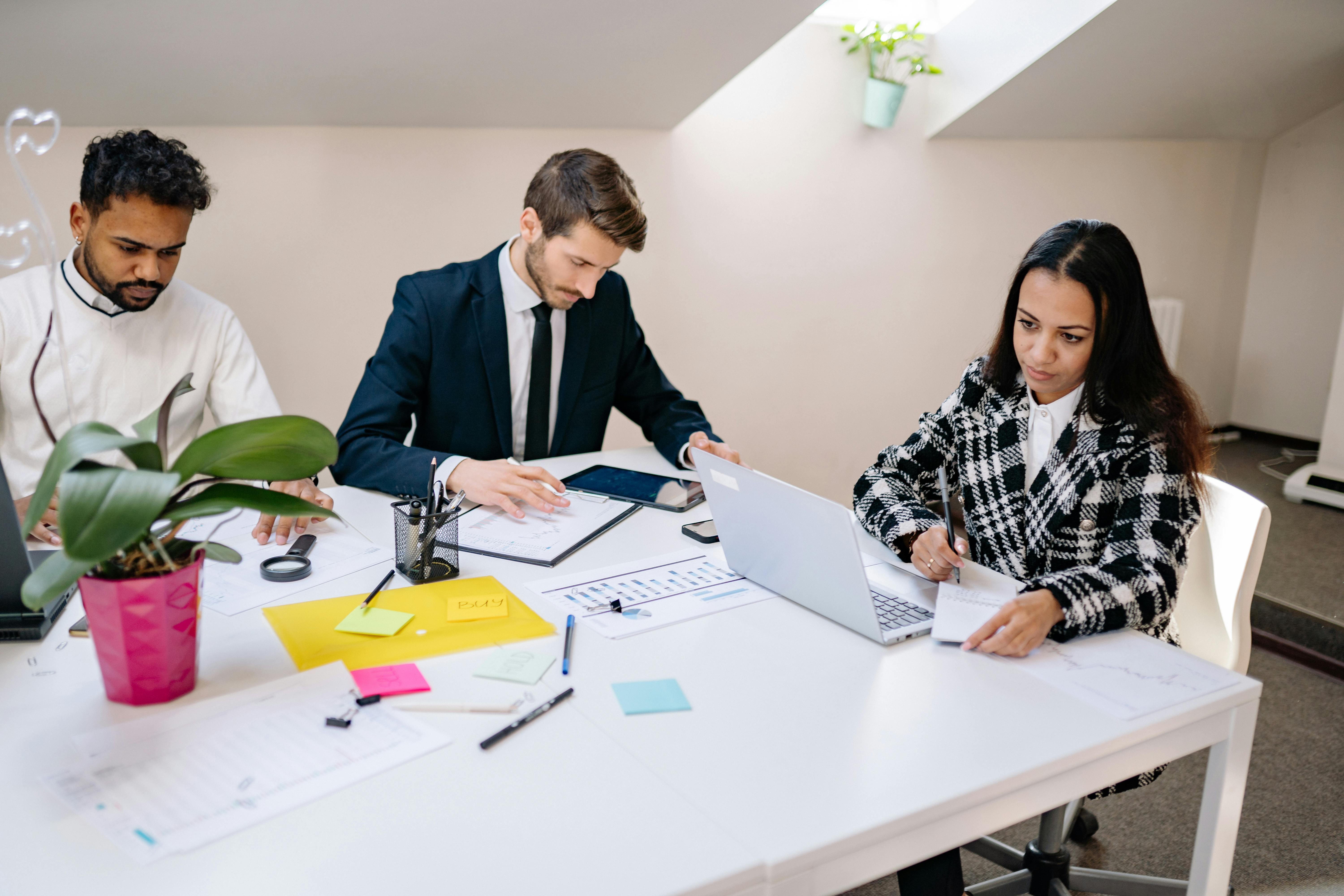Colleagues Working in an Office · Free Stock Photo
