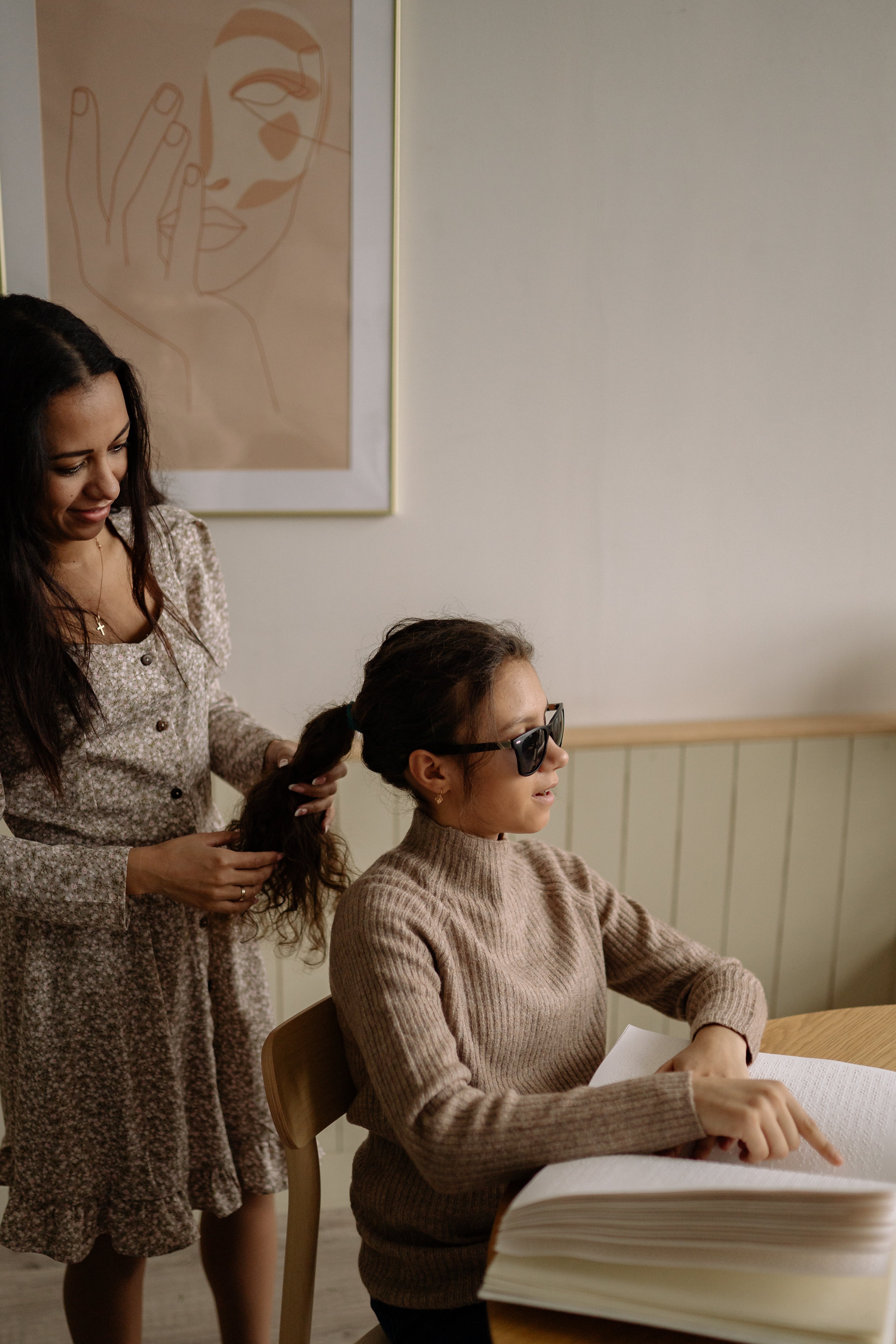 Woman tying a Blind Person's Hair · Free Stock Photo