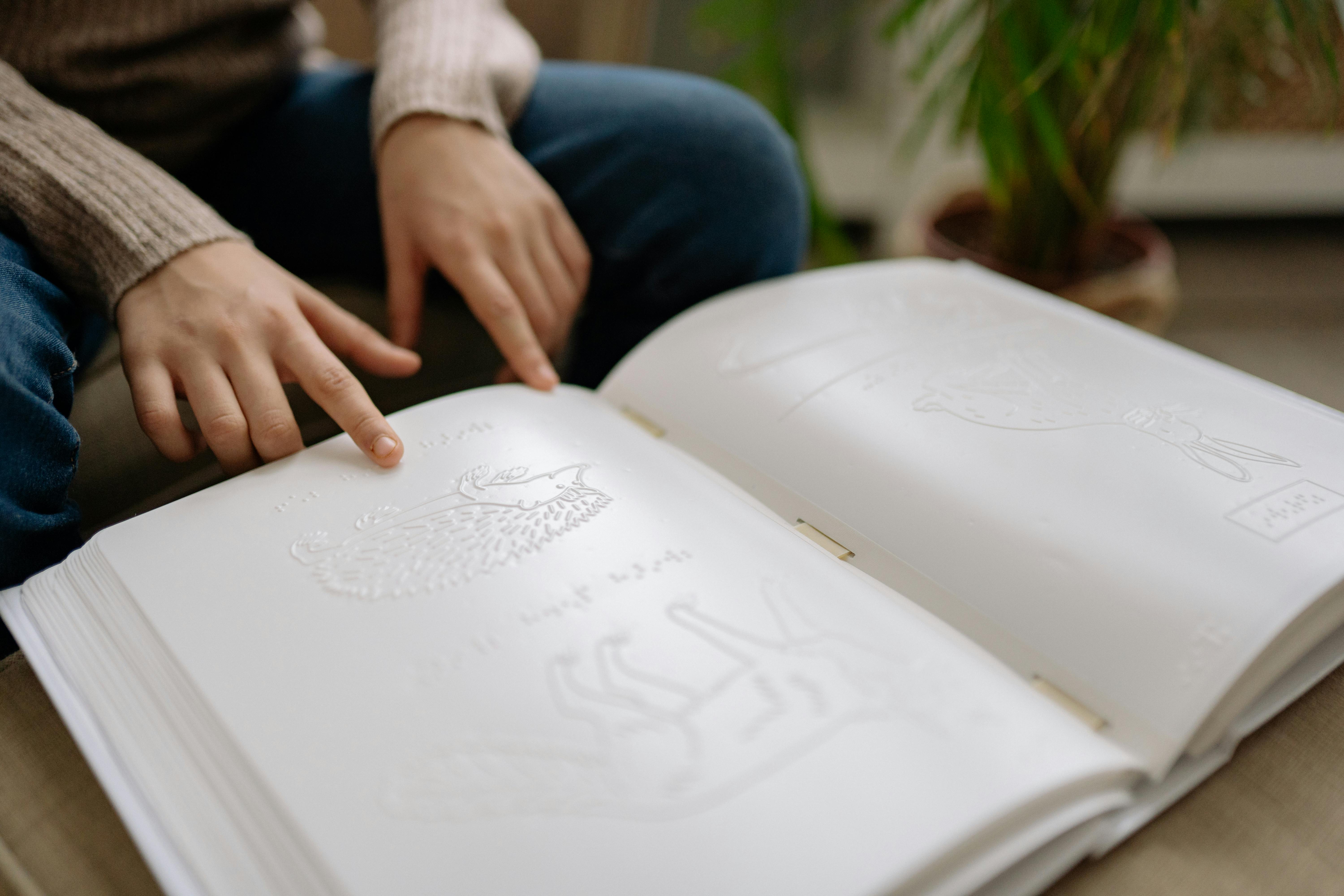 Photo of Person Holding White Braille Paper · Free Stock Photo