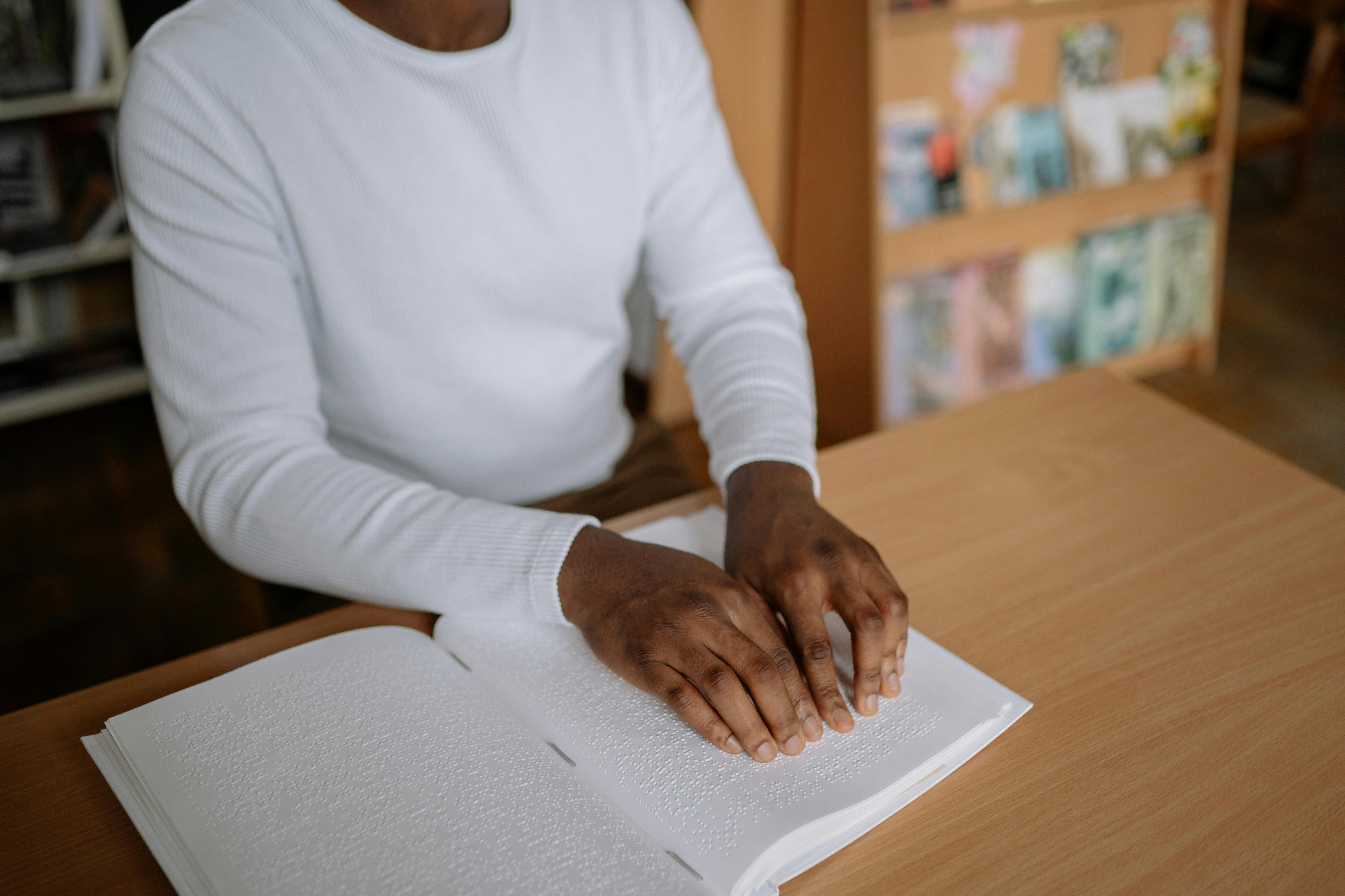 Blind Person Reading by Using Braille System · Free Stock Photo