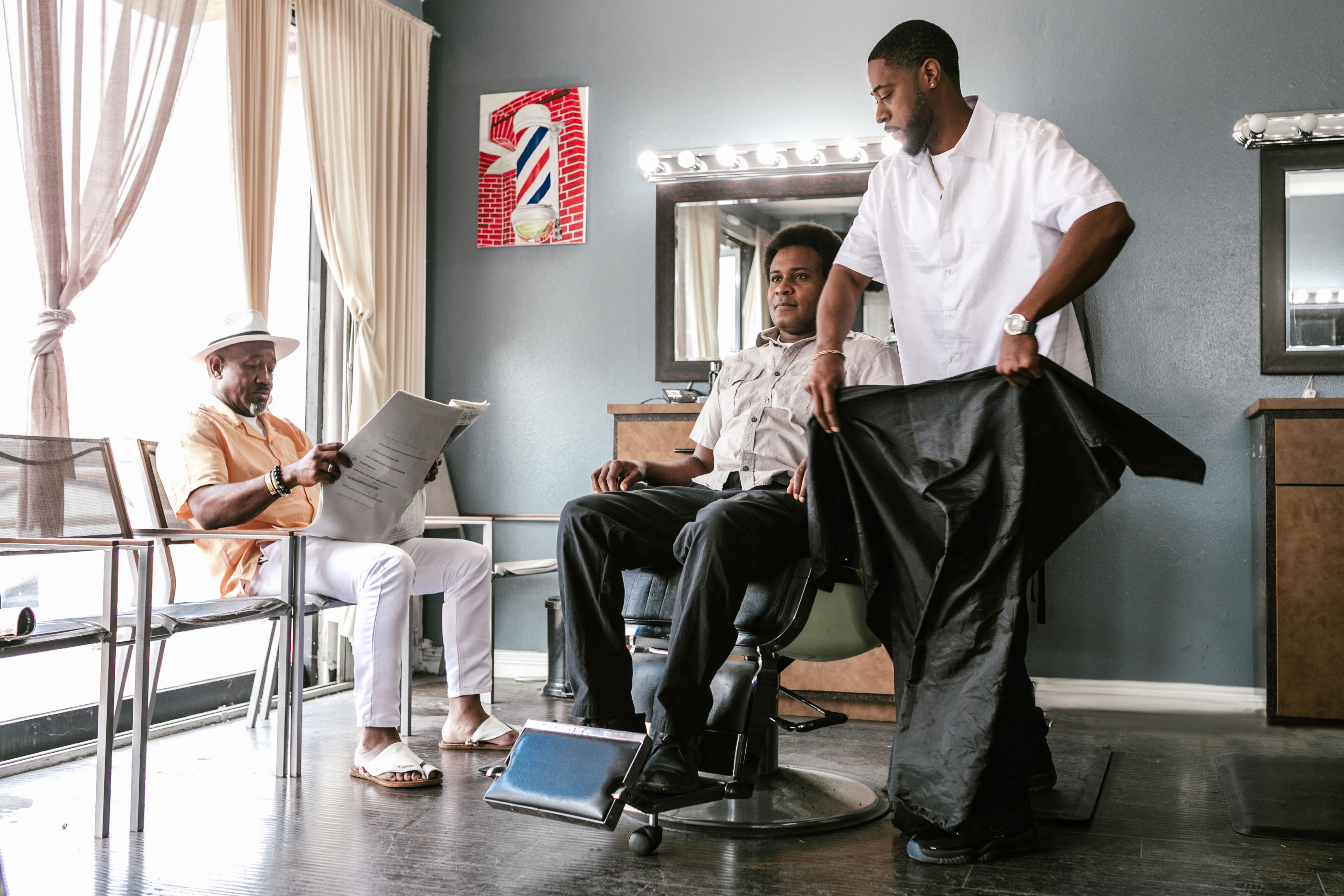 Man Waiting Inside a Barber Shop · Free Stock Photo