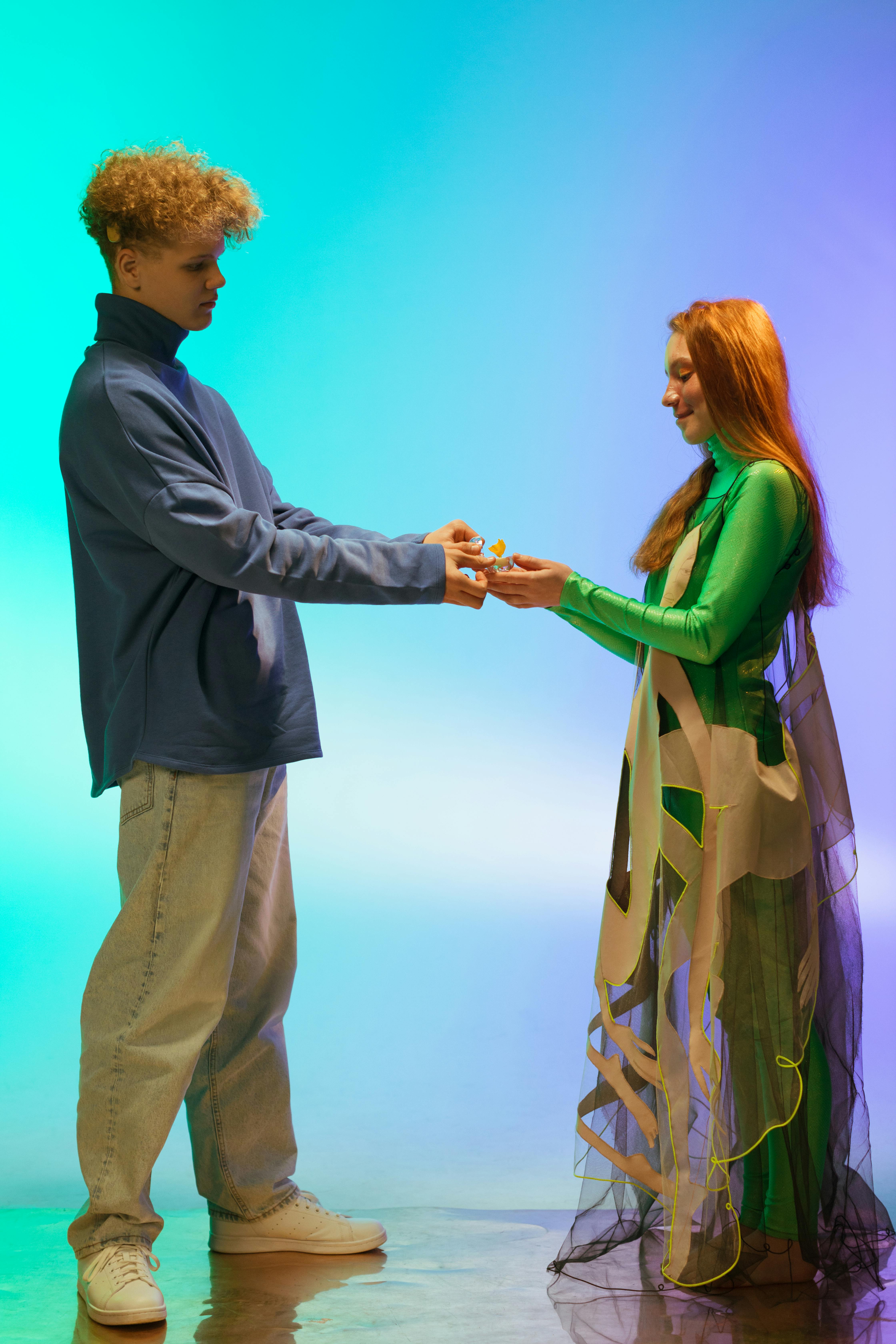 A Man Giving an Object to a Woman · Free Stock Photo