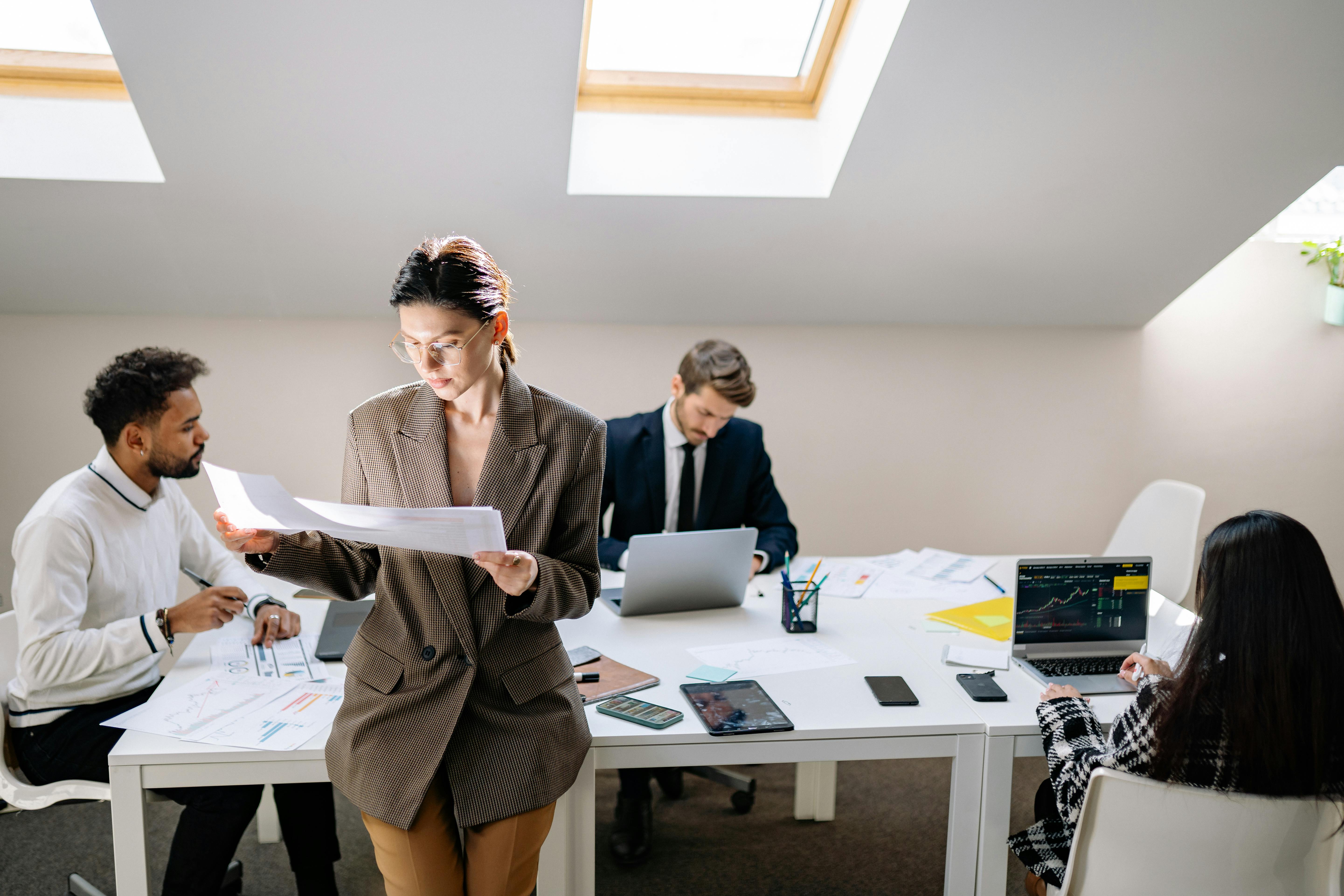 Three People Standing Near Table · Free Stock Photo