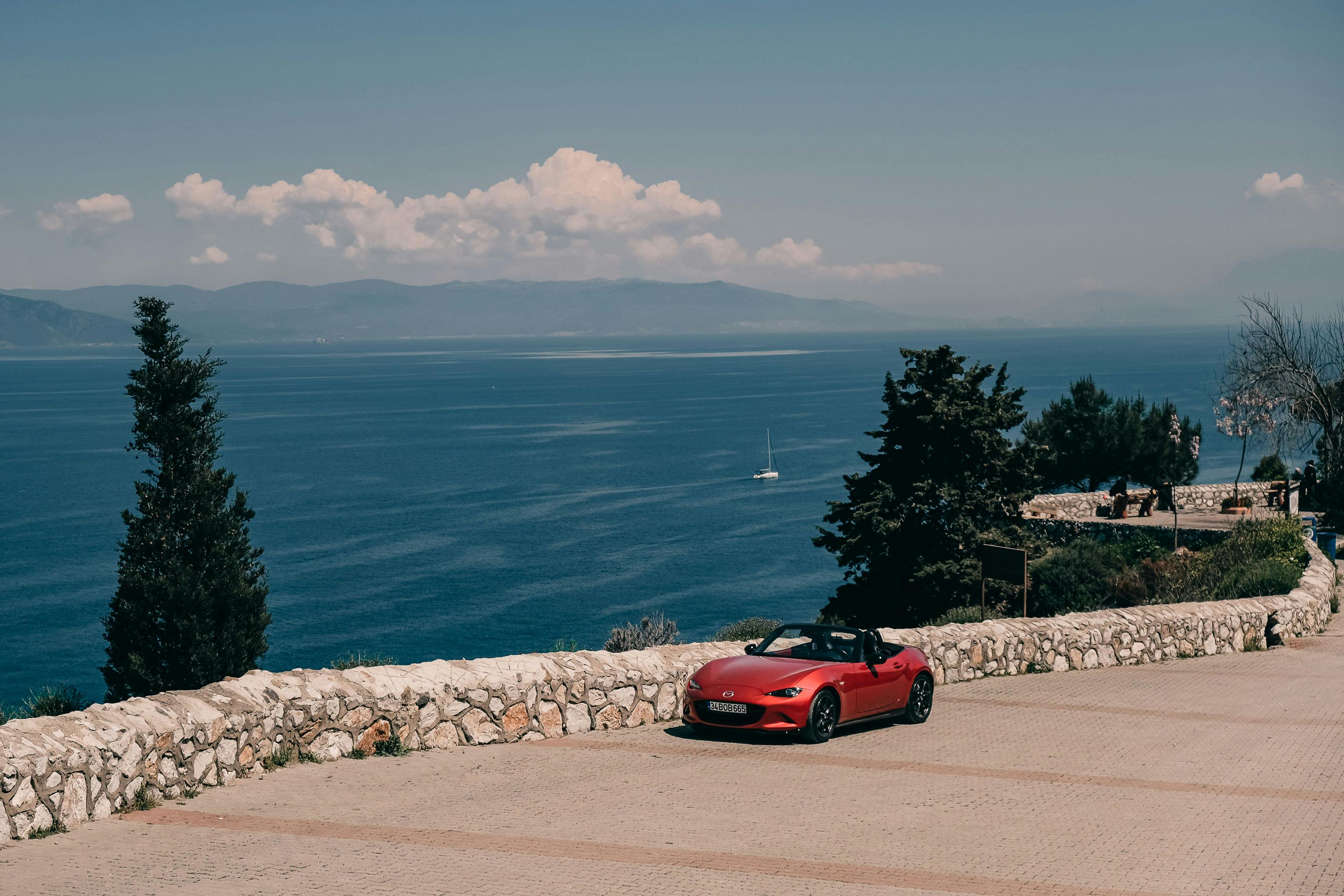 Sports Car near Sea Shore · Free Stock Photo