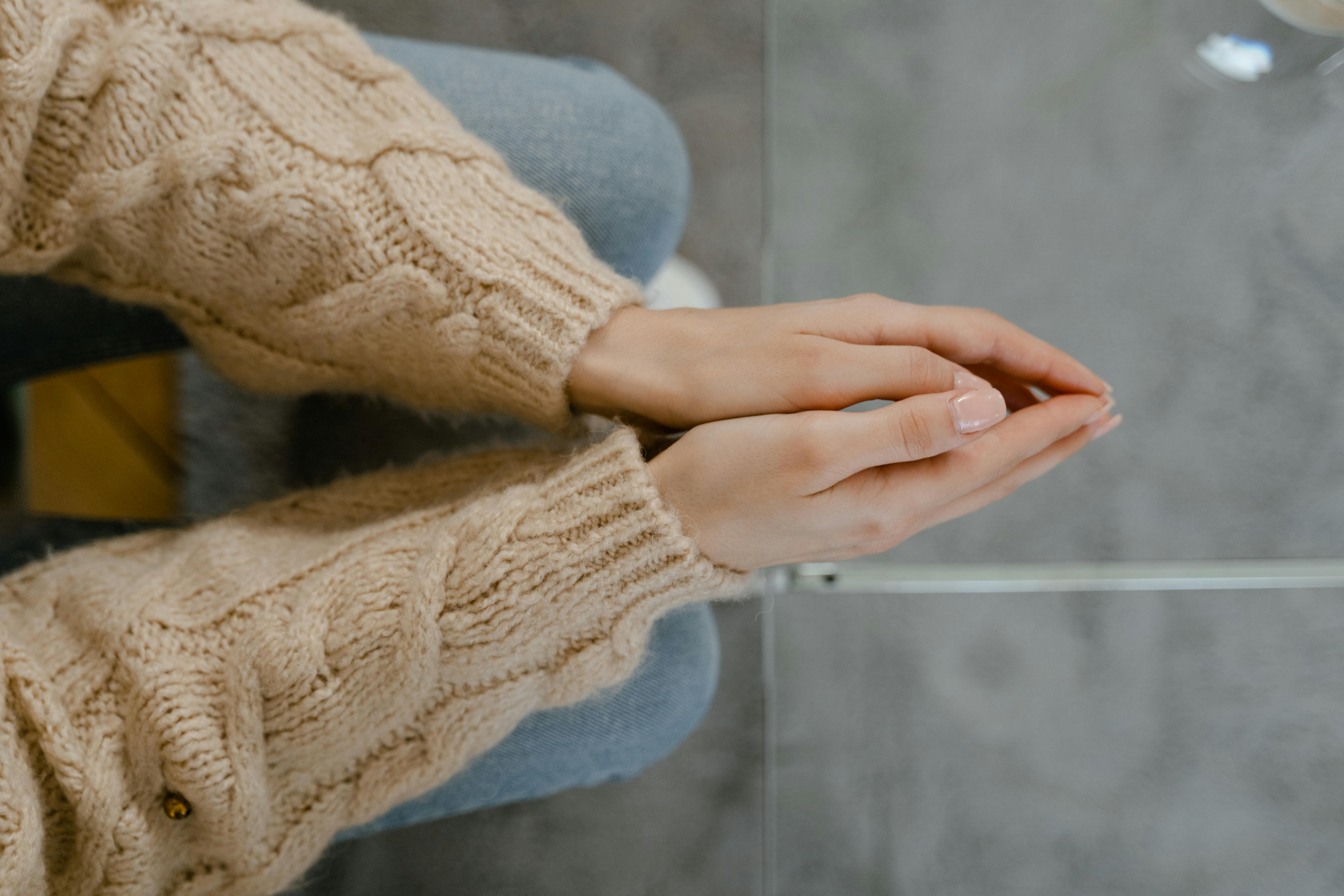 Top View of Person Sitting with Hands Together · Free Stock Photo