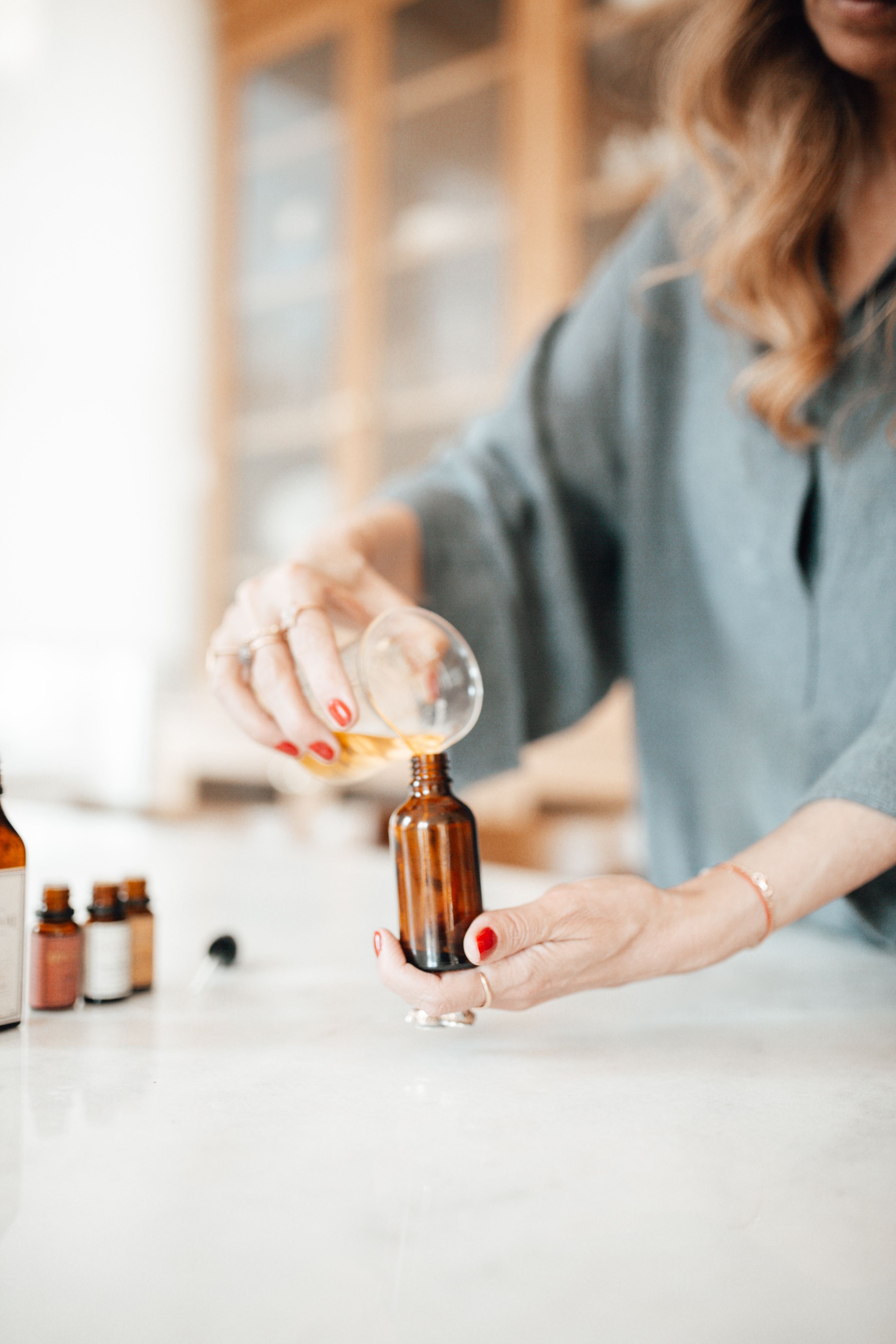 Close up of Woman Pouring to Flask · Free Stock Photo