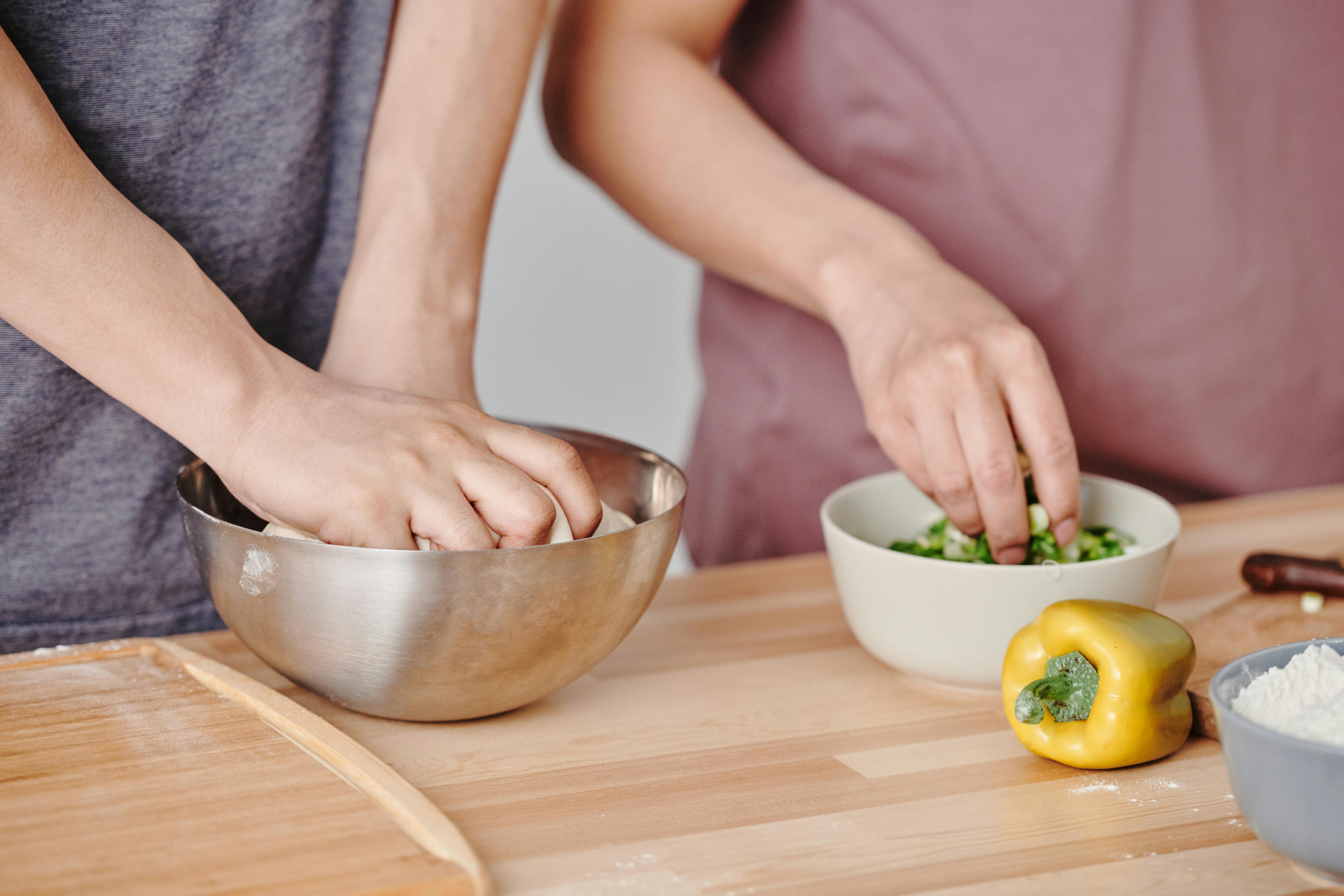 Photo of a Person's Hands Kneading Dough · Free Stock Photo