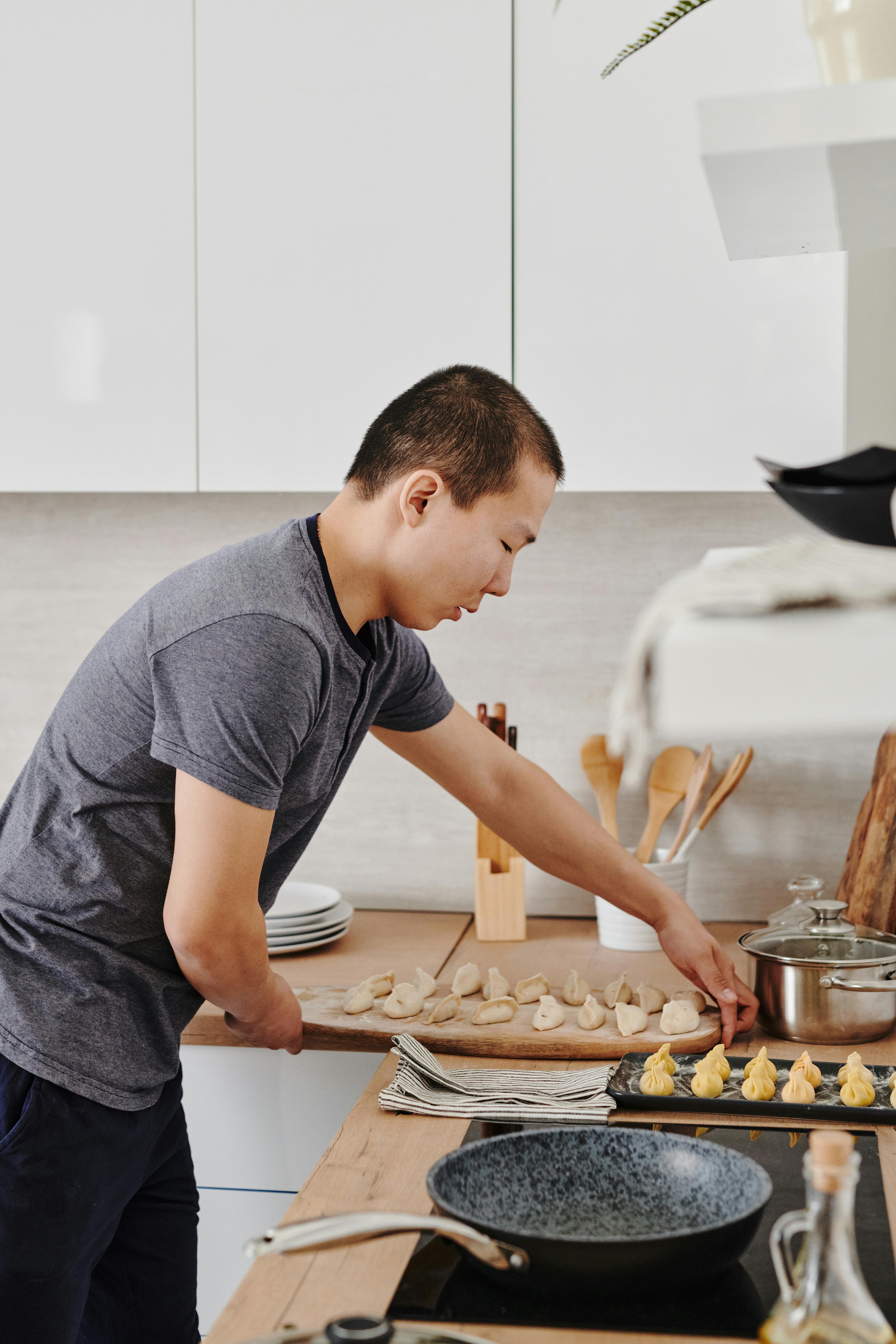 Person Cooking Dumplings in the Pan · Free Stock Photo