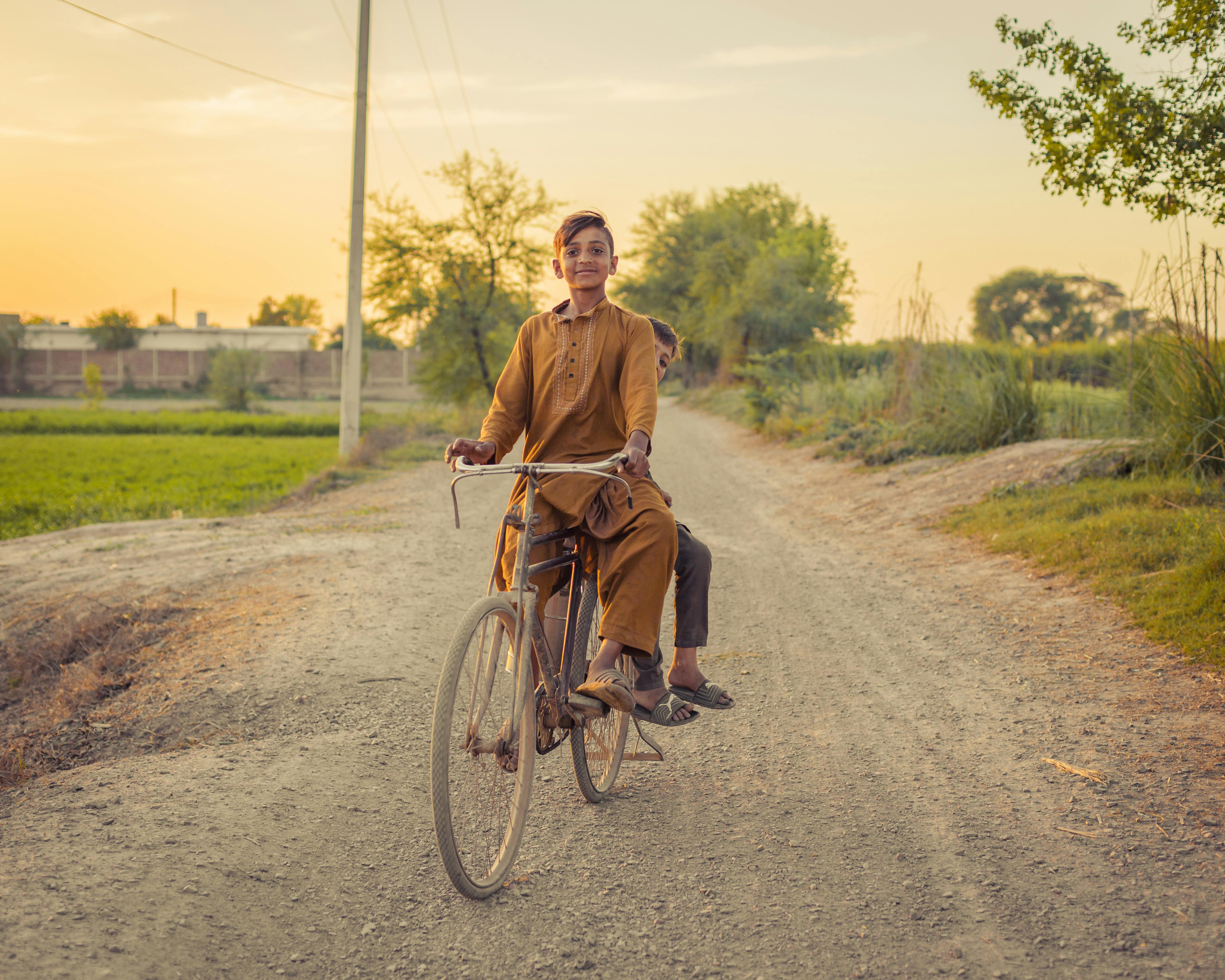 Boy Riding Bike at Daytime · Free Stock Photo