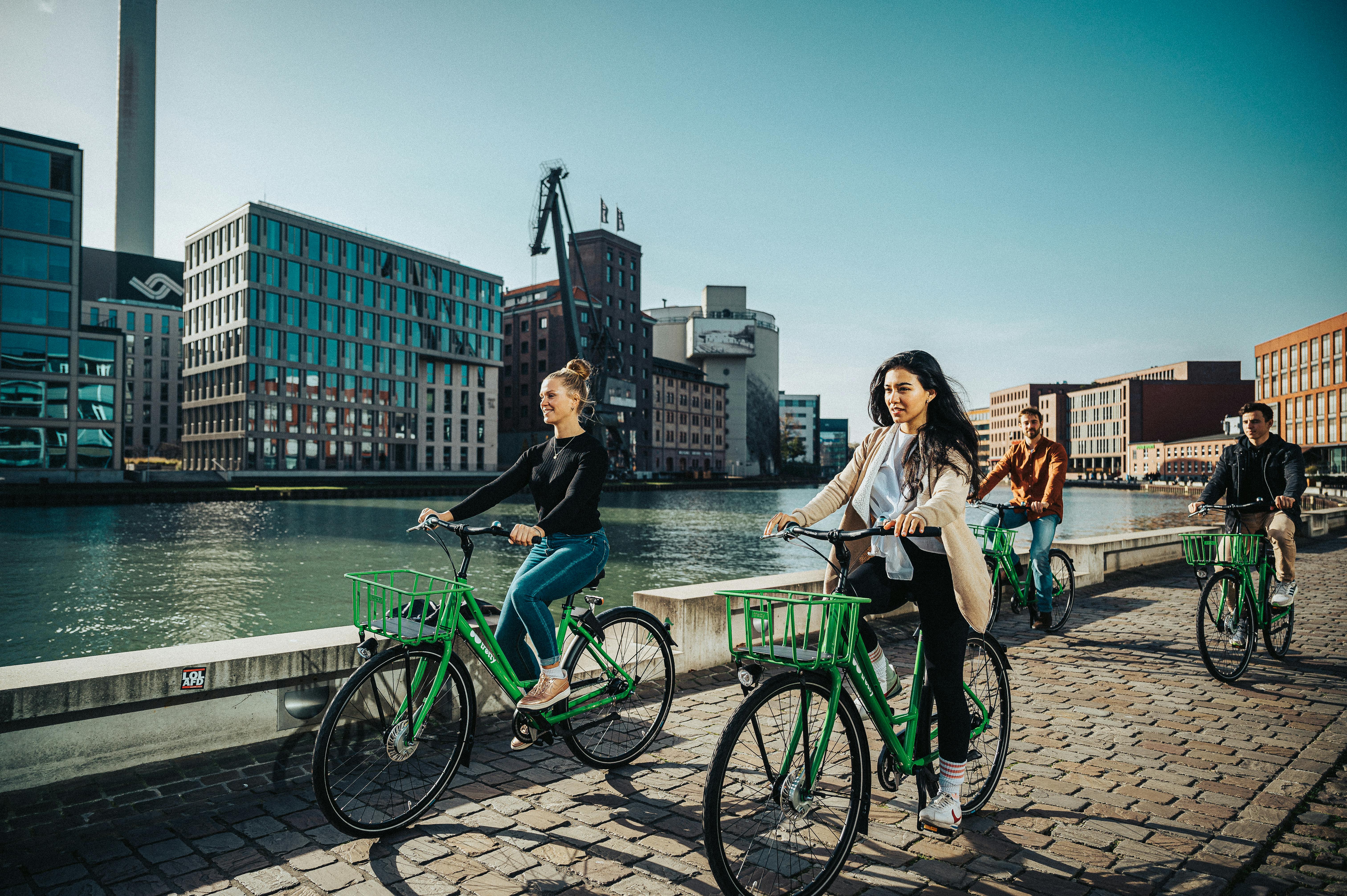 Group of Friends Riding a Bike Together · Free Stock Photo
