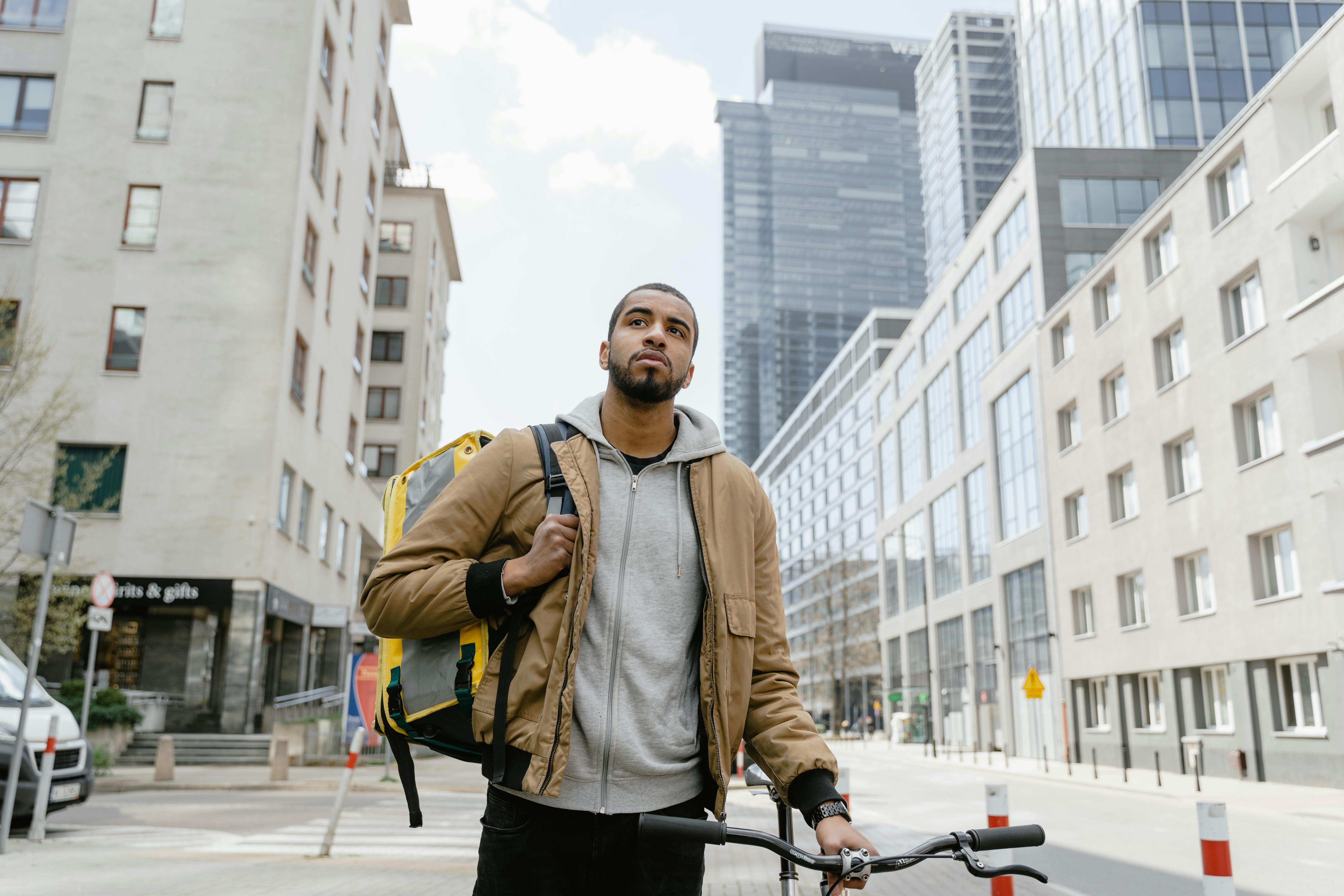 Man Carrying a Bag Walking · Free Stock Photo