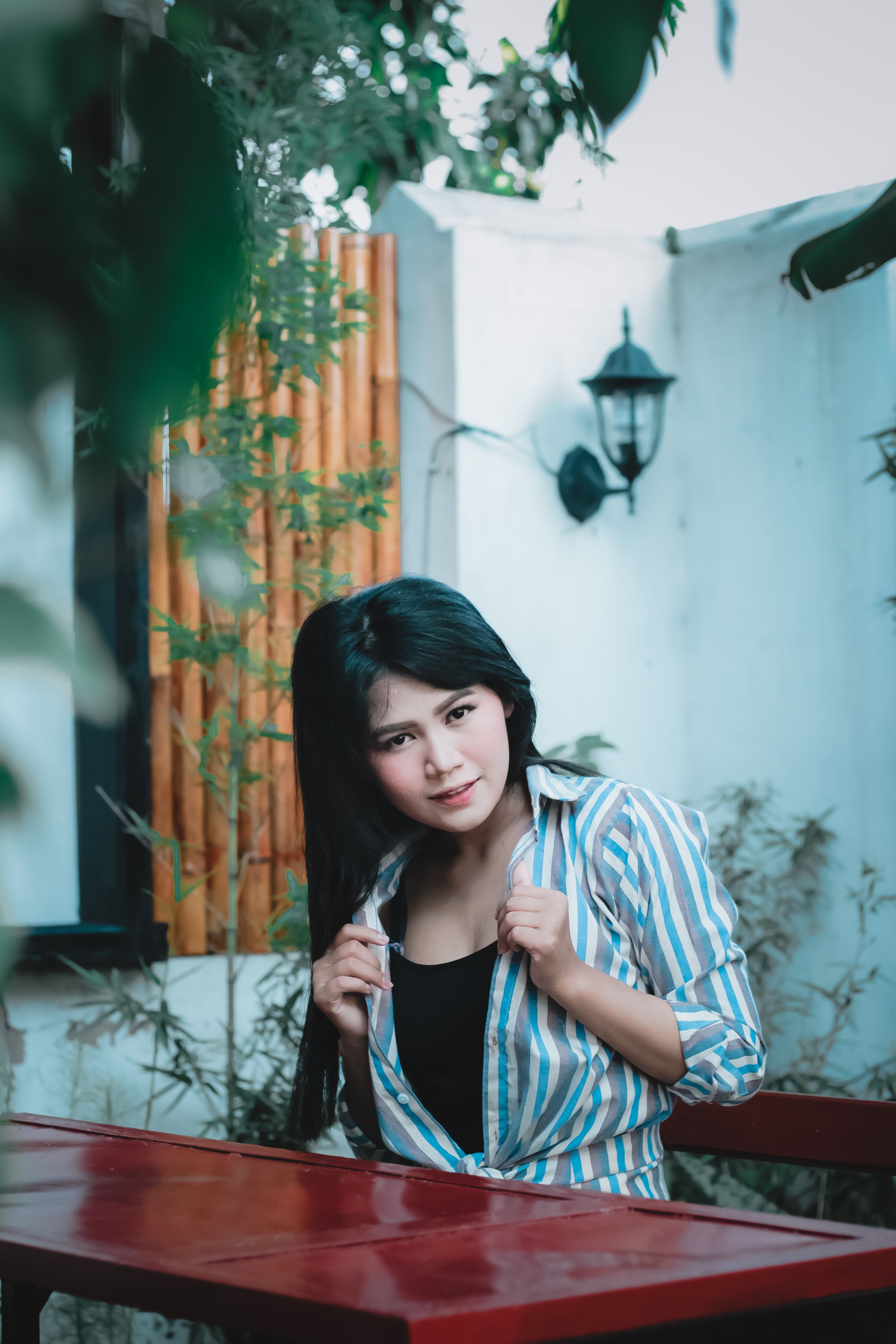 A Woman Pointing her Chin · Free Stock Photo