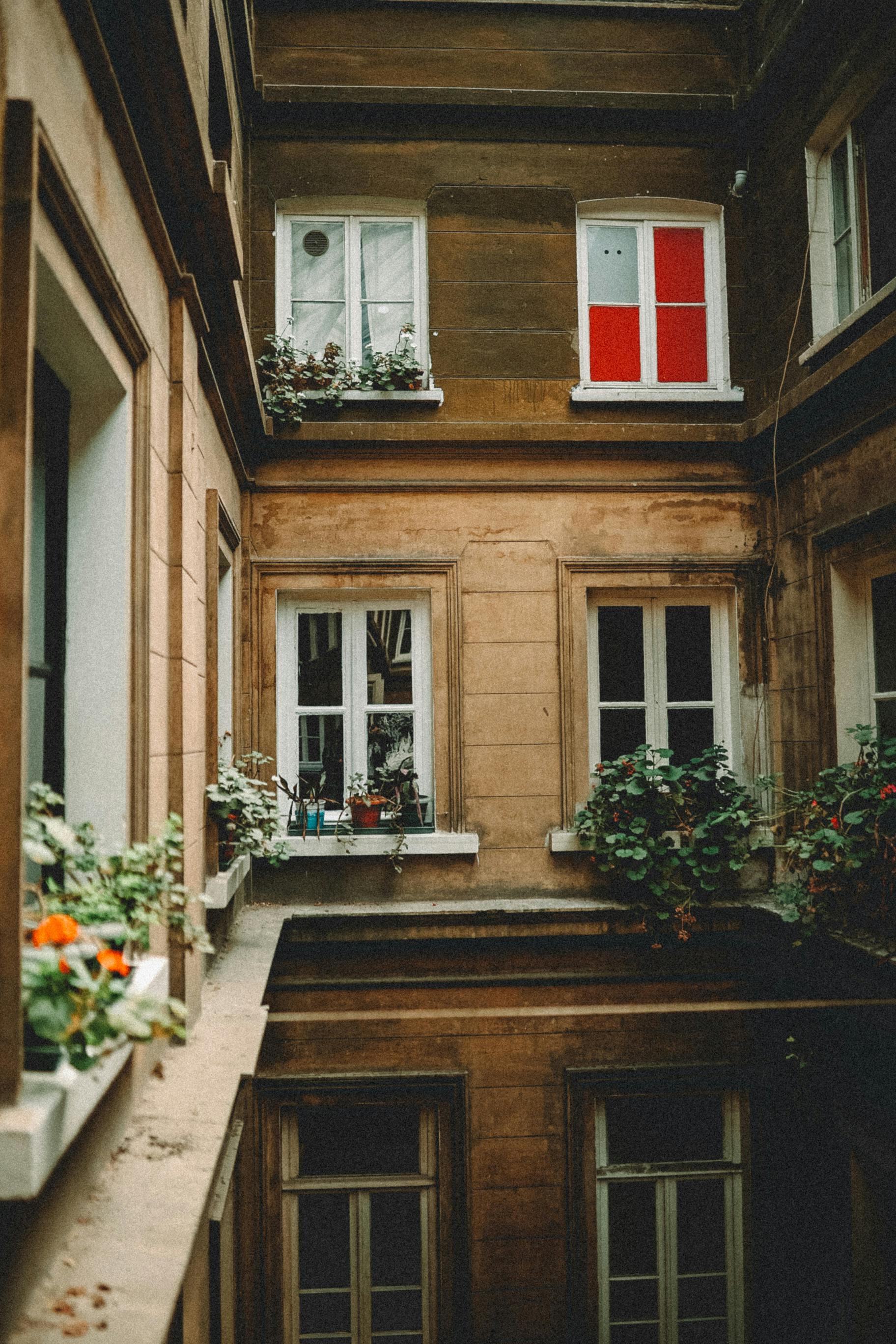 A Figurine on a Windowsill · Free Stock Photo