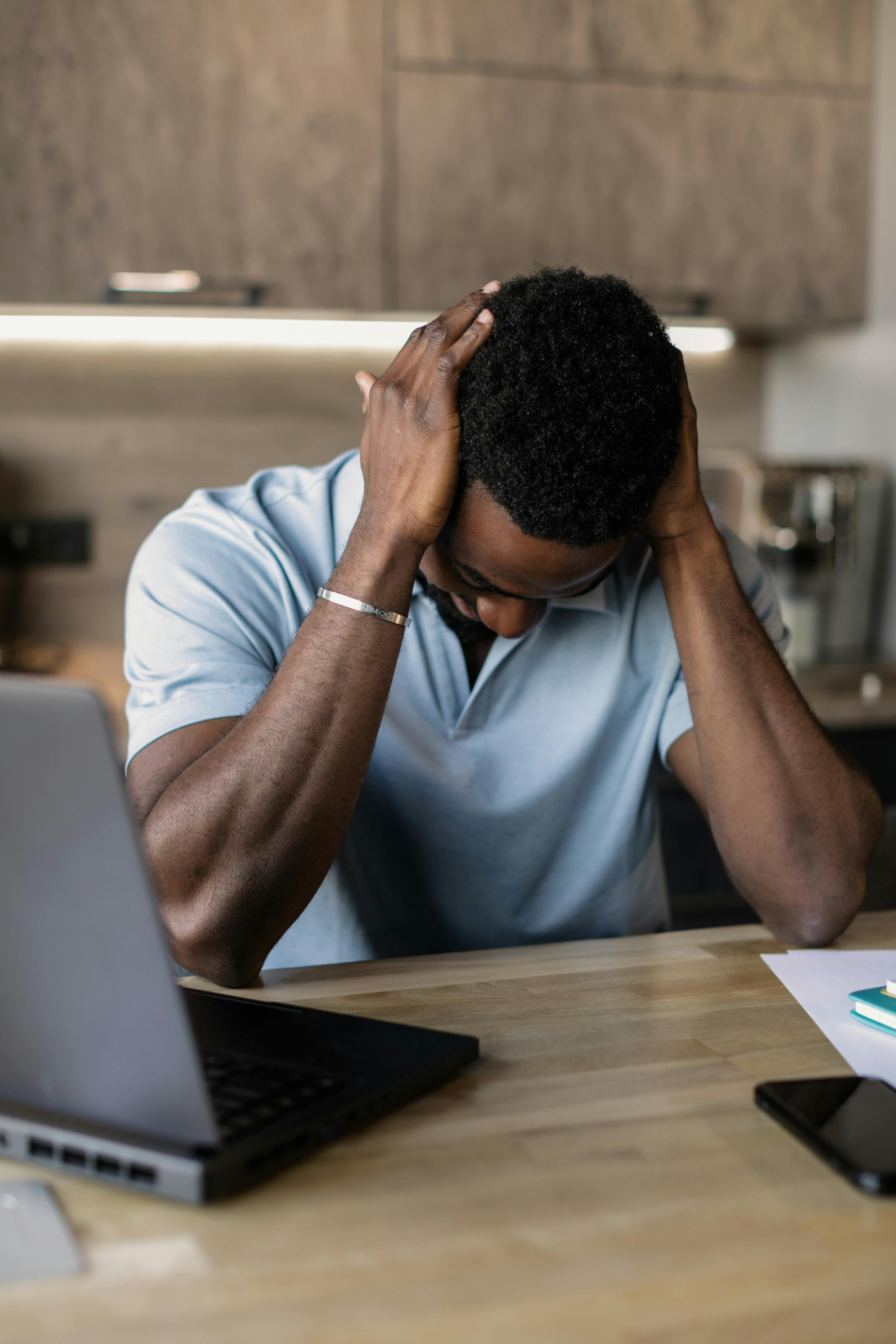 A Man Places His Hands on His Head · Free Stock Photo