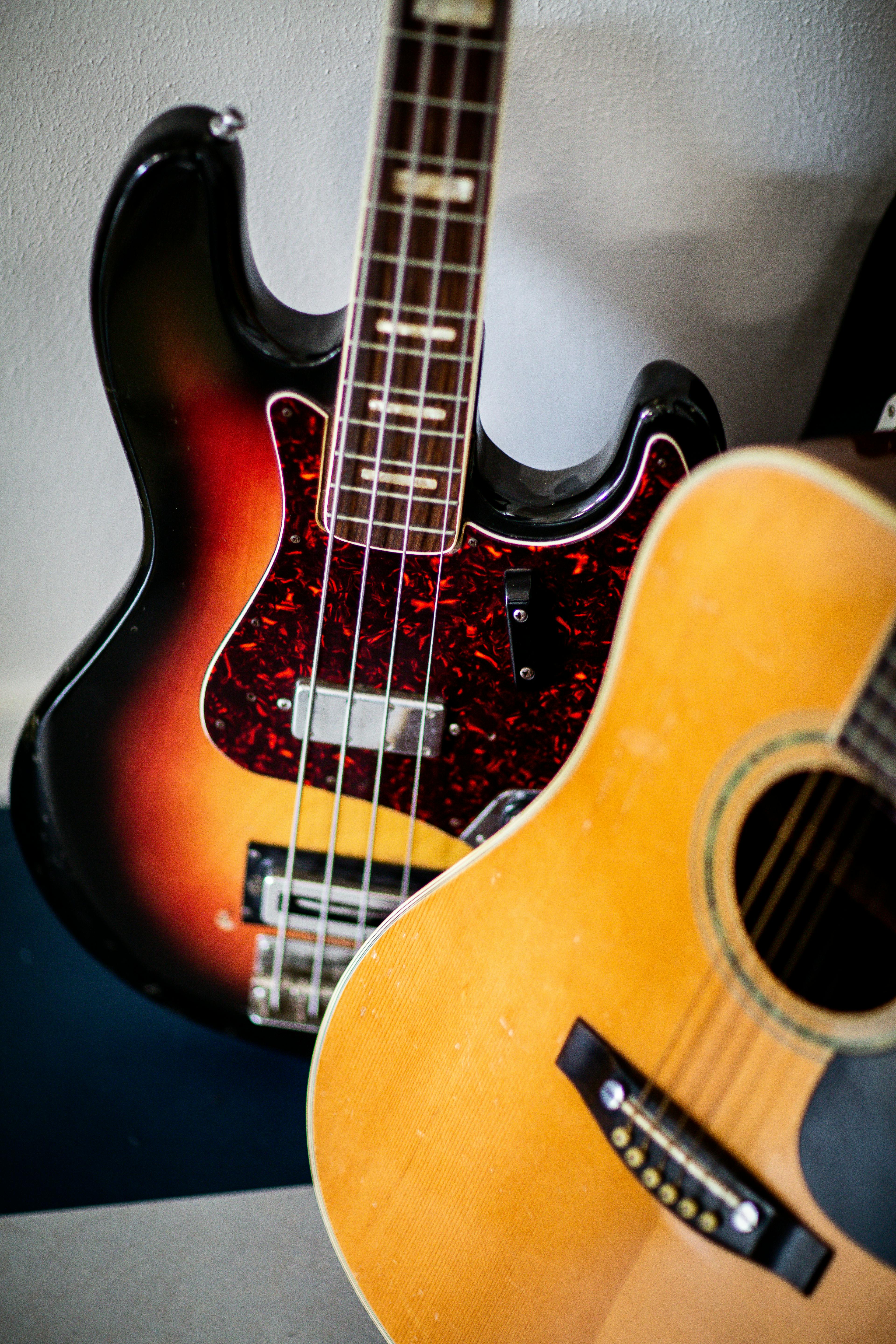 An Electric Guitar beside an Acoustic Guitar · Free Stock Photo
