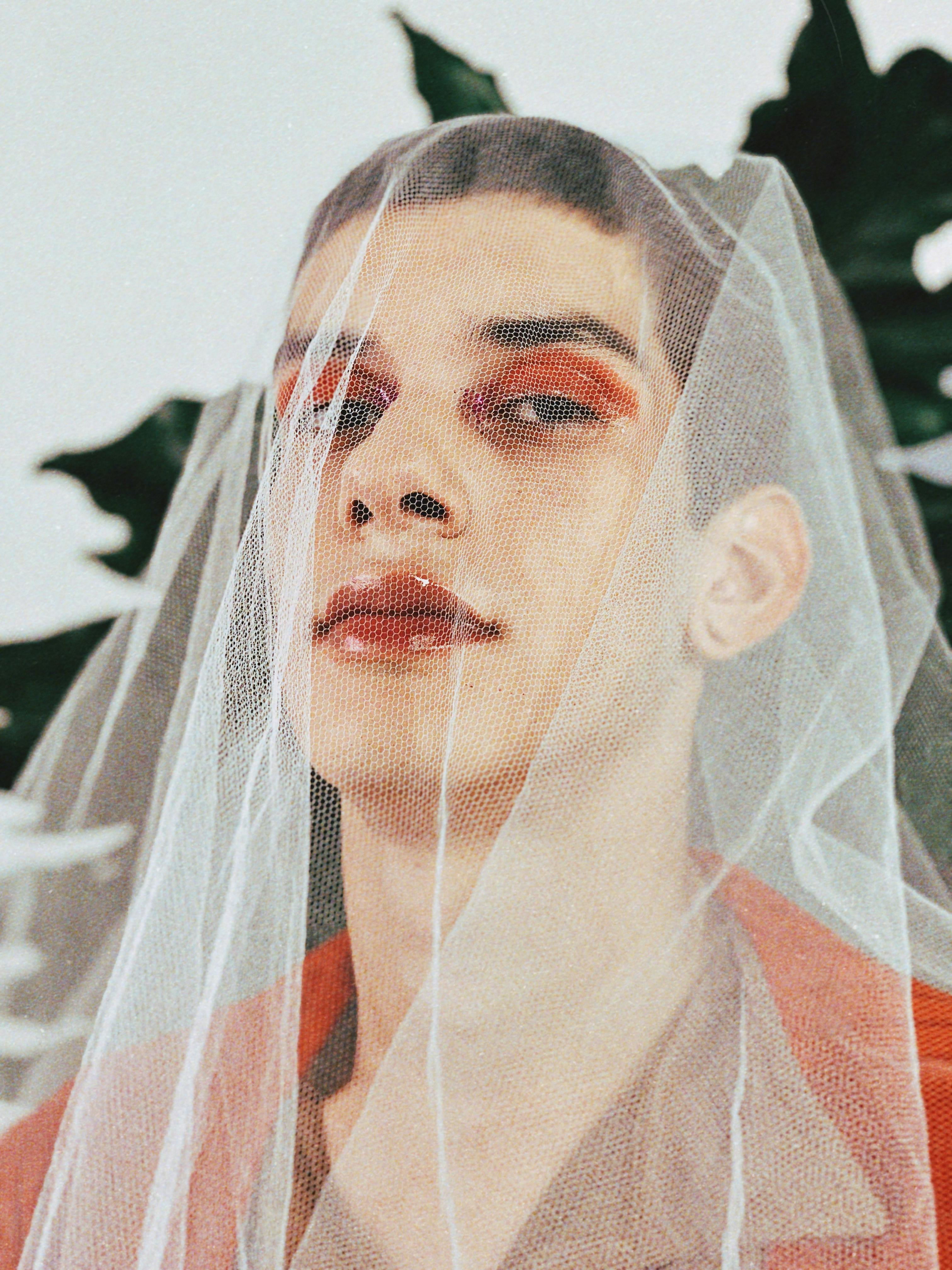 A Man in Makeup and a Veil · Free Stock Photo