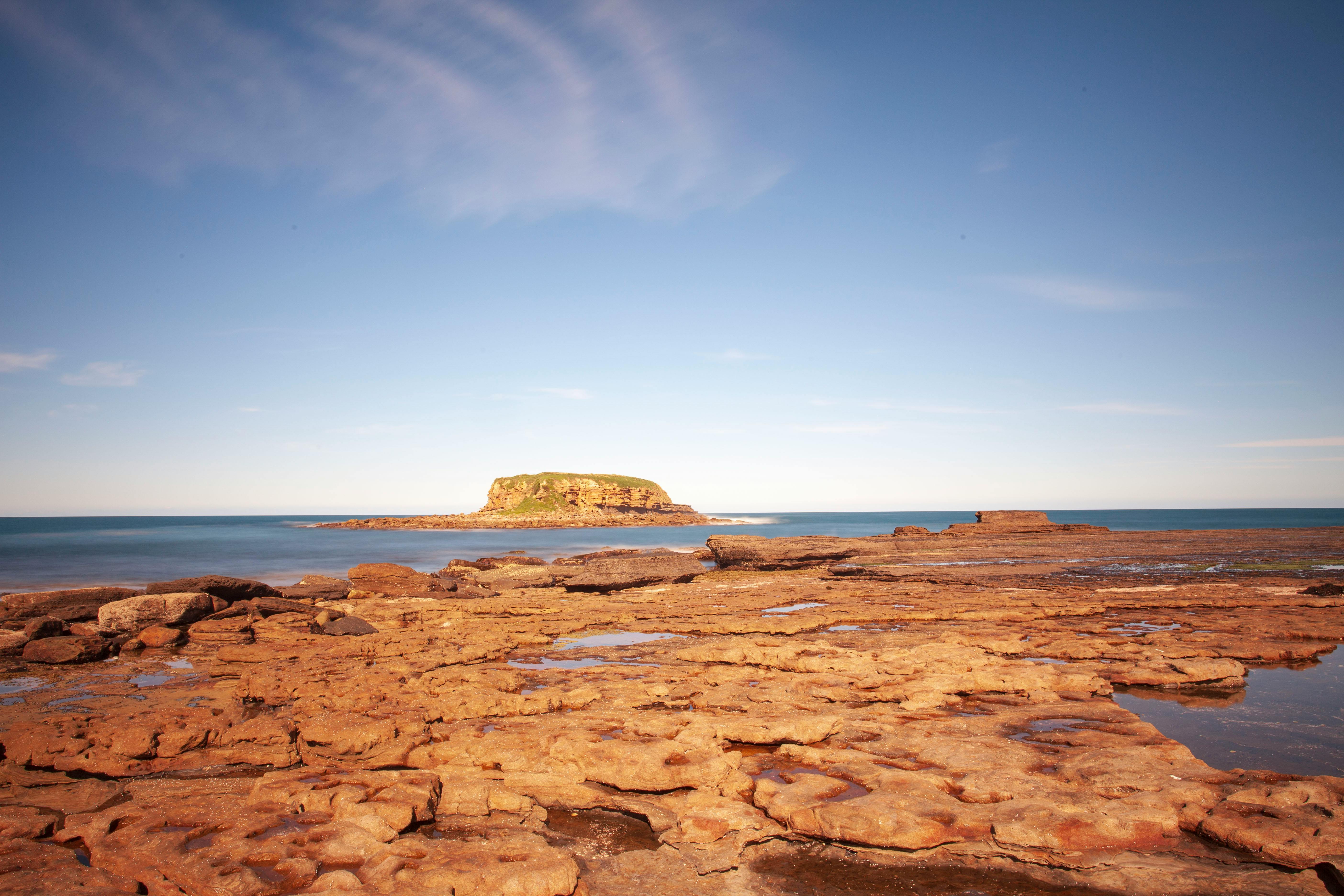 Photo Of Seashore With Rocks During Daylight · Free Stock Photo