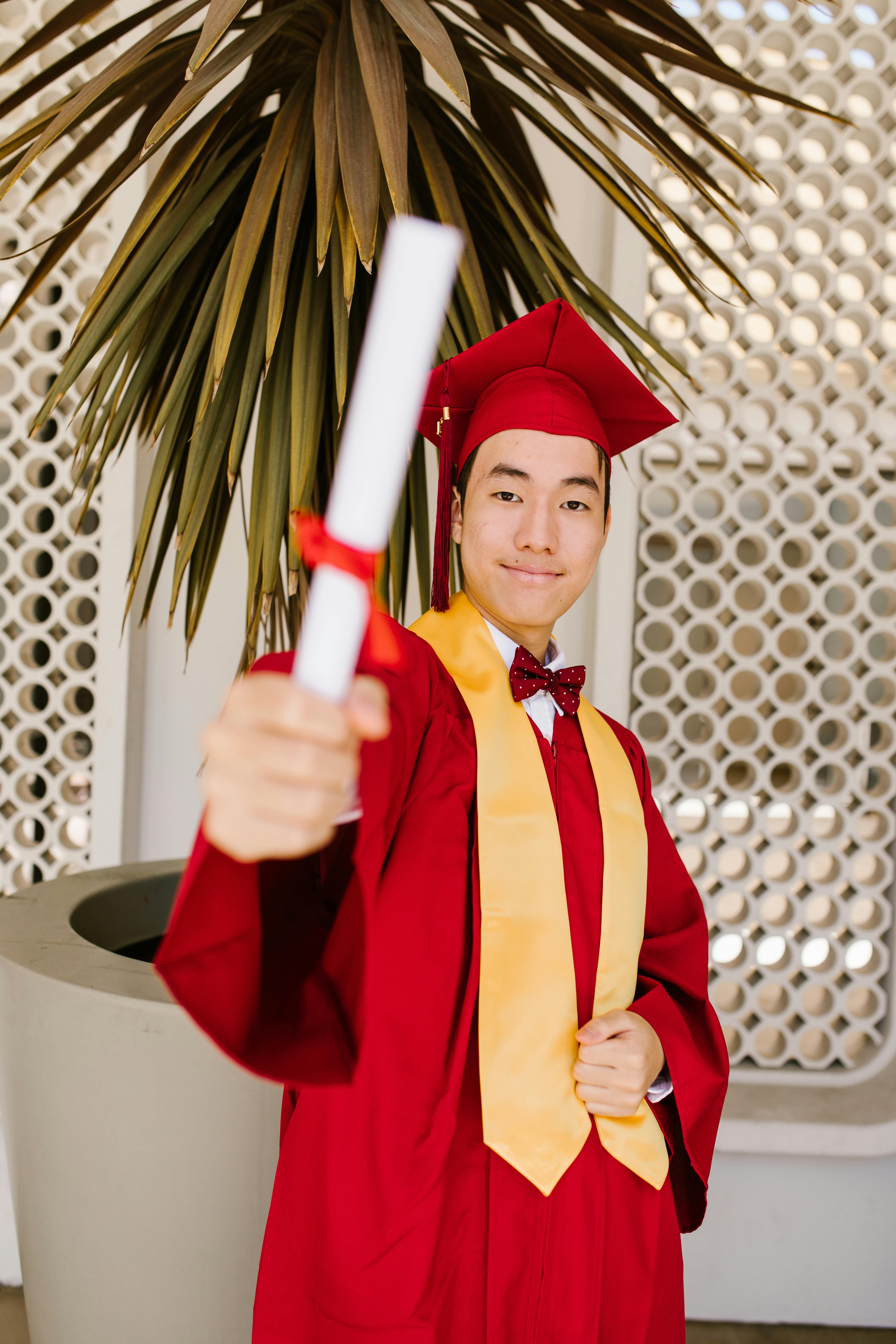 Newly Graduate Student Holding Her Graduation Certificate · Free Stock ...