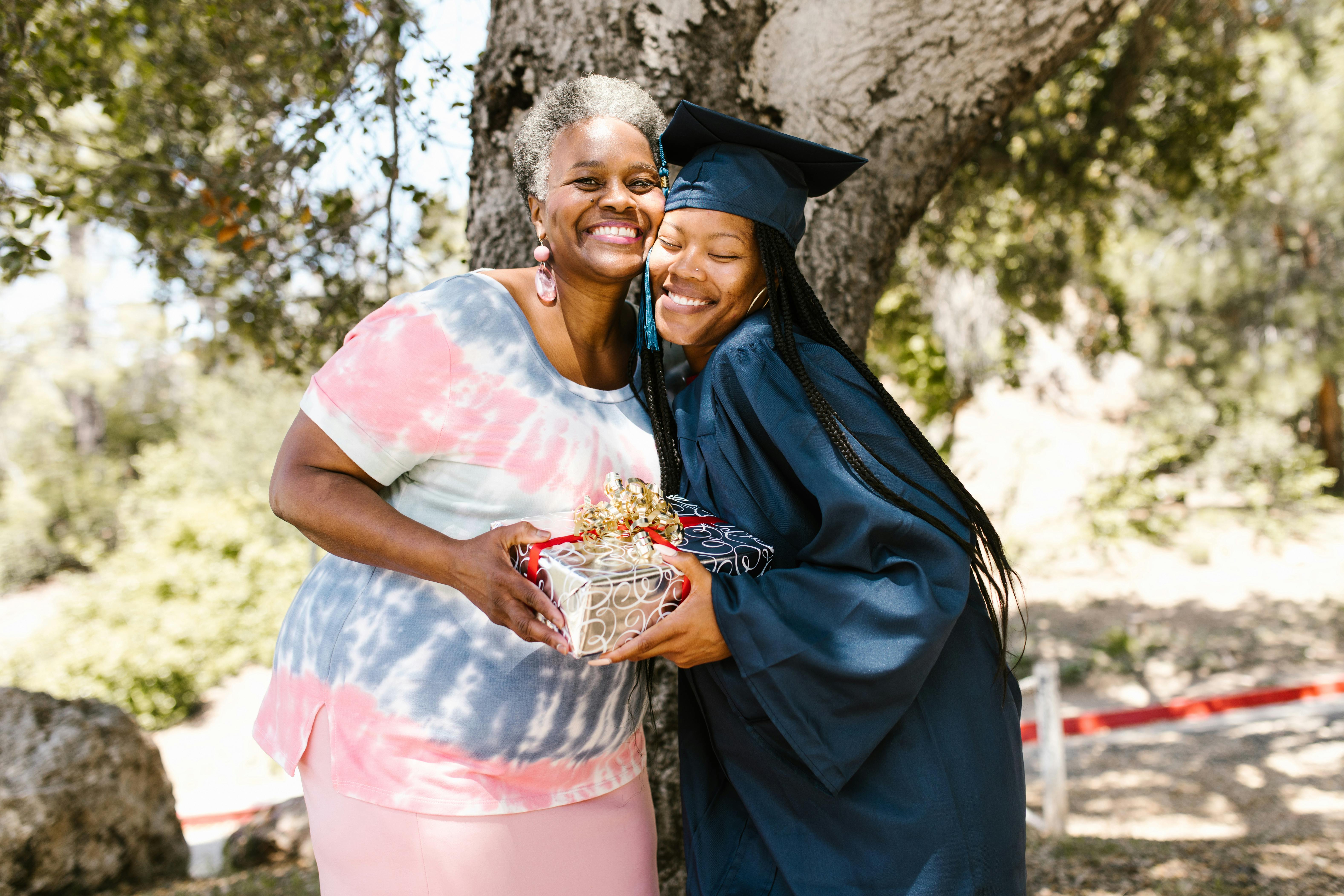 A Graduate Hugging Her Mother · Free Stock Photo
