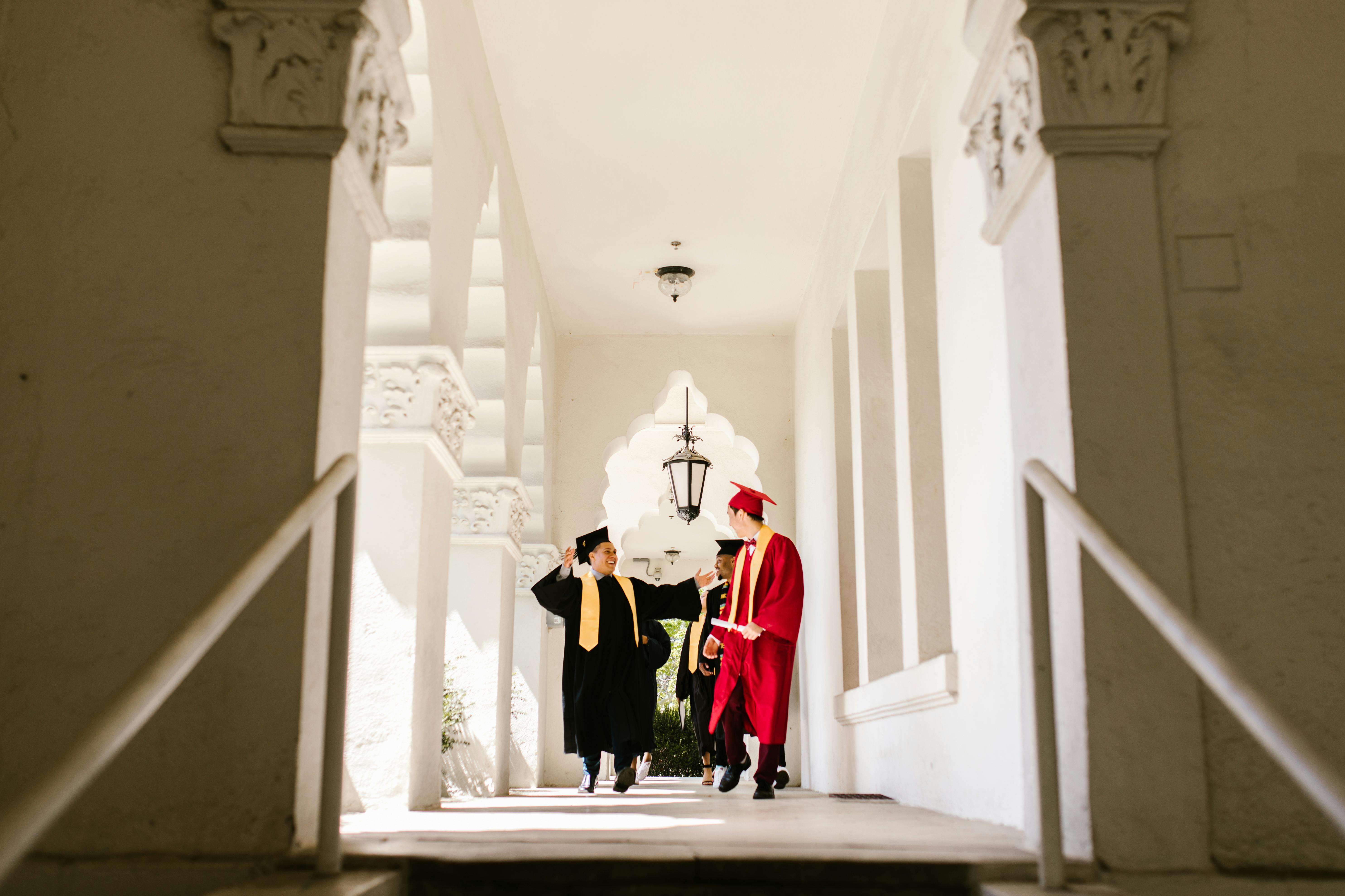 Gray Haired Woman Smiling Beside the Newly Graduate Student · Free ...