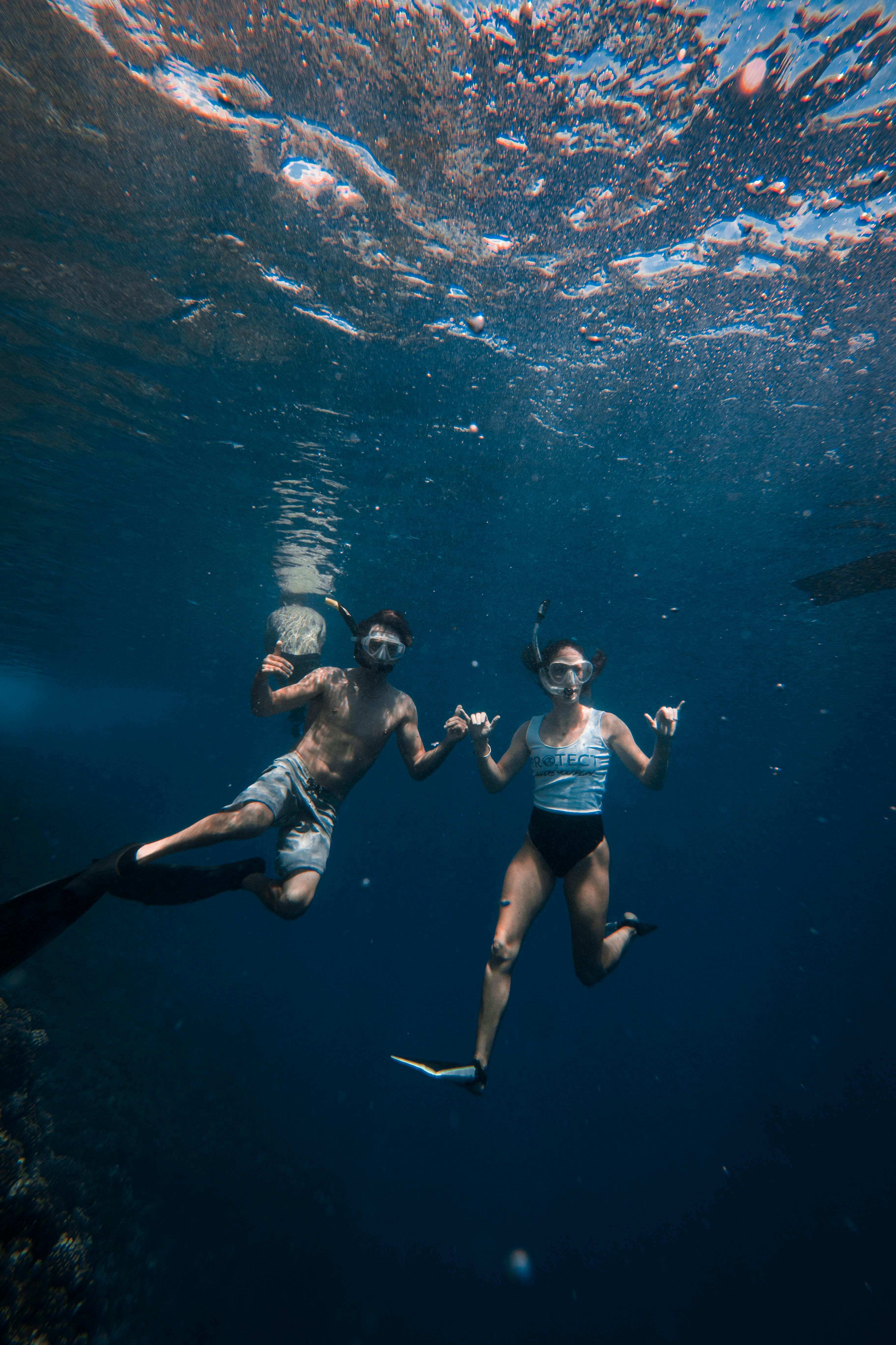 Underwater Picture of Man and Woman Snorkeling · Free Stock Photo
