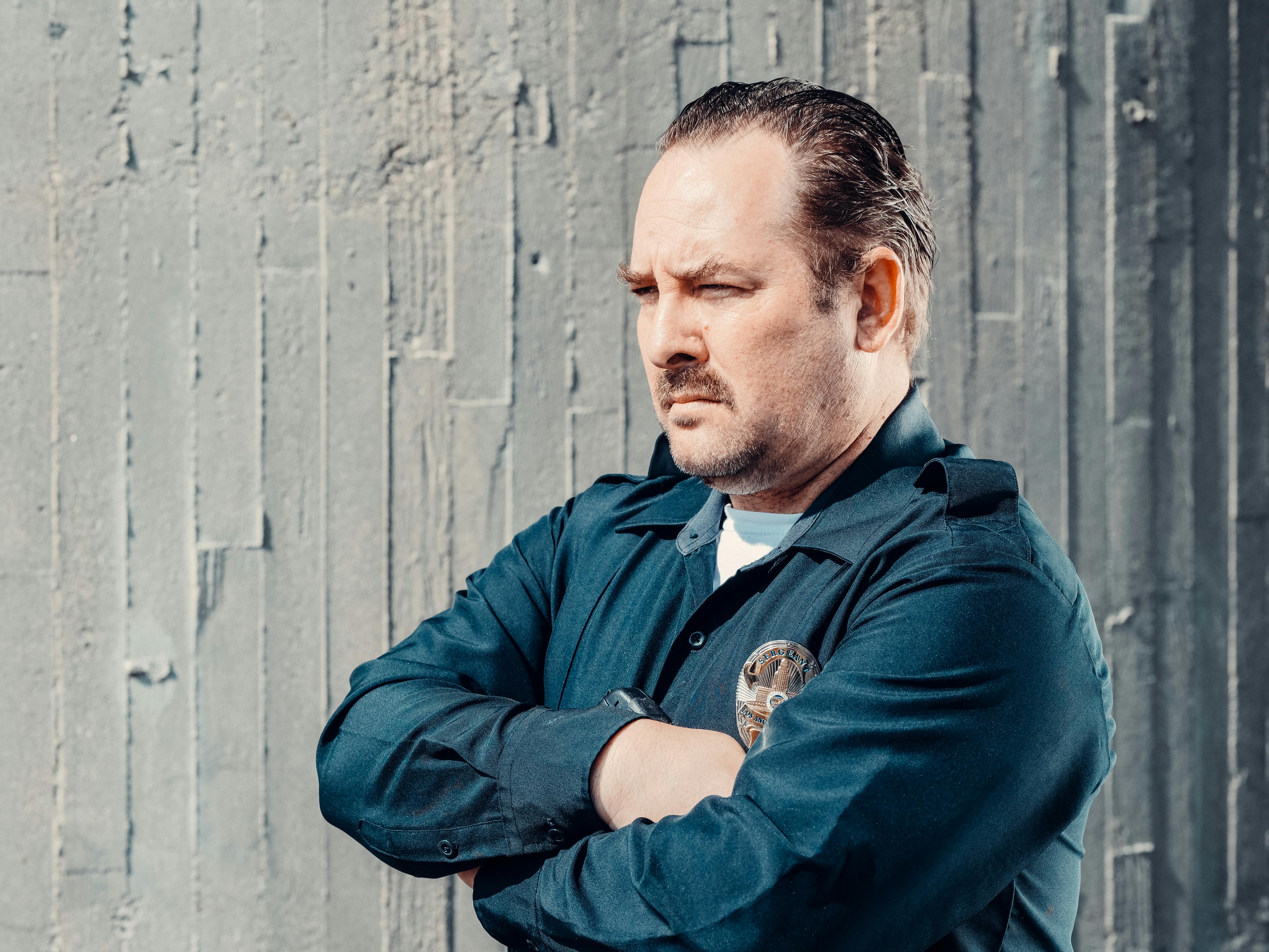 A Policeman in his Blue Uniform · Free Stock Photo