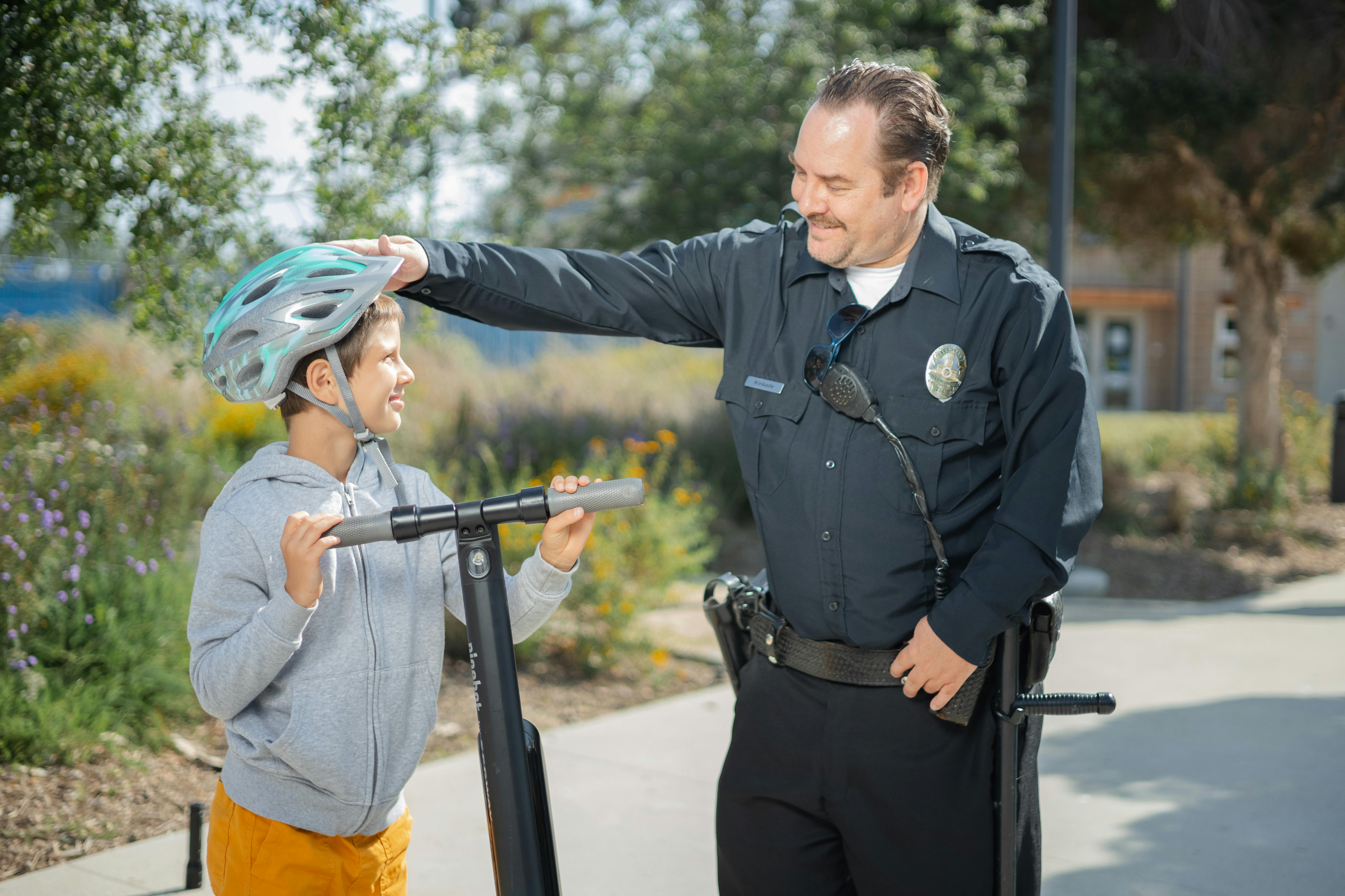 Policeman Talking to a Child · Free Stock Photo
