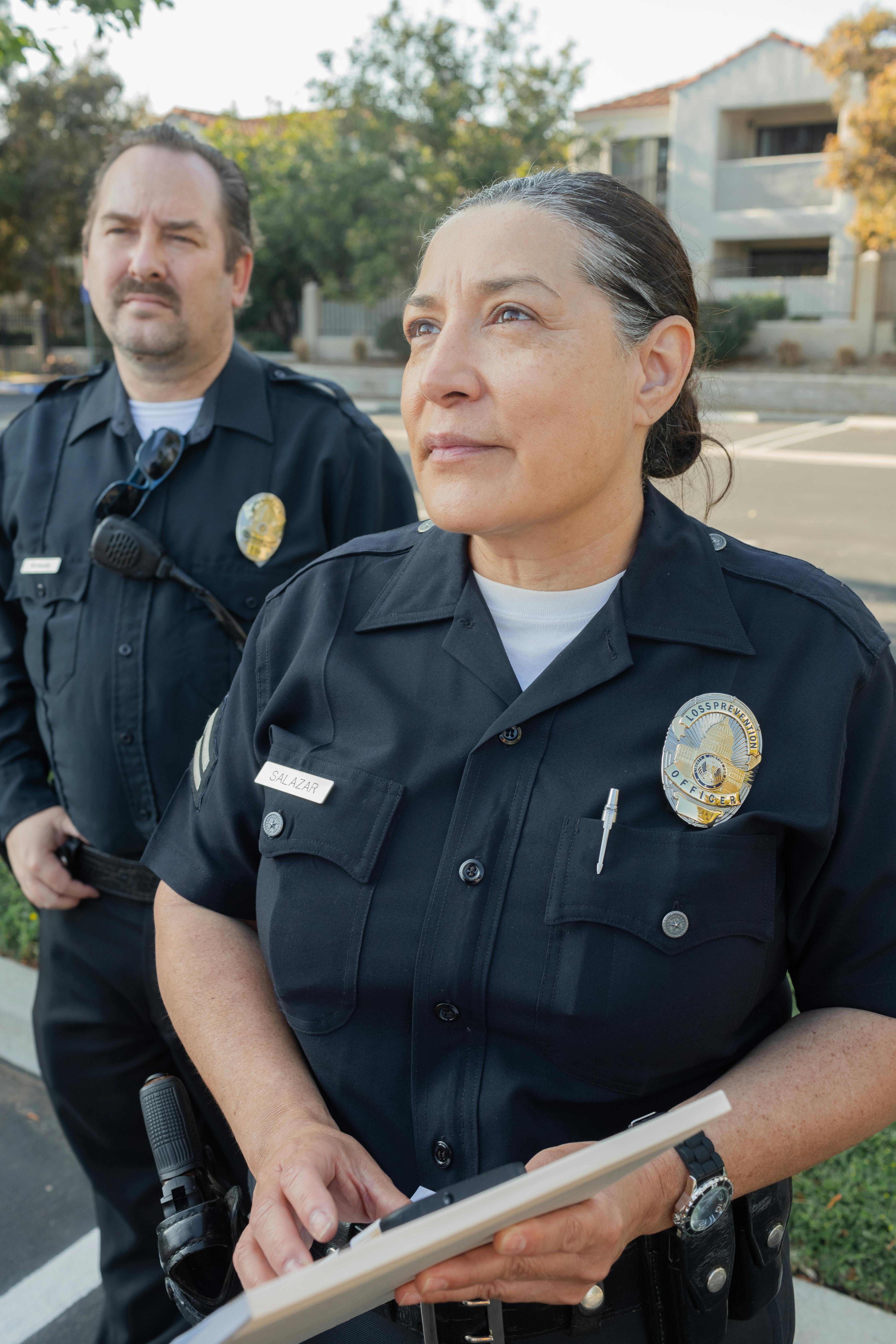 A Policewoman Holding Papers · Free Stock Photo