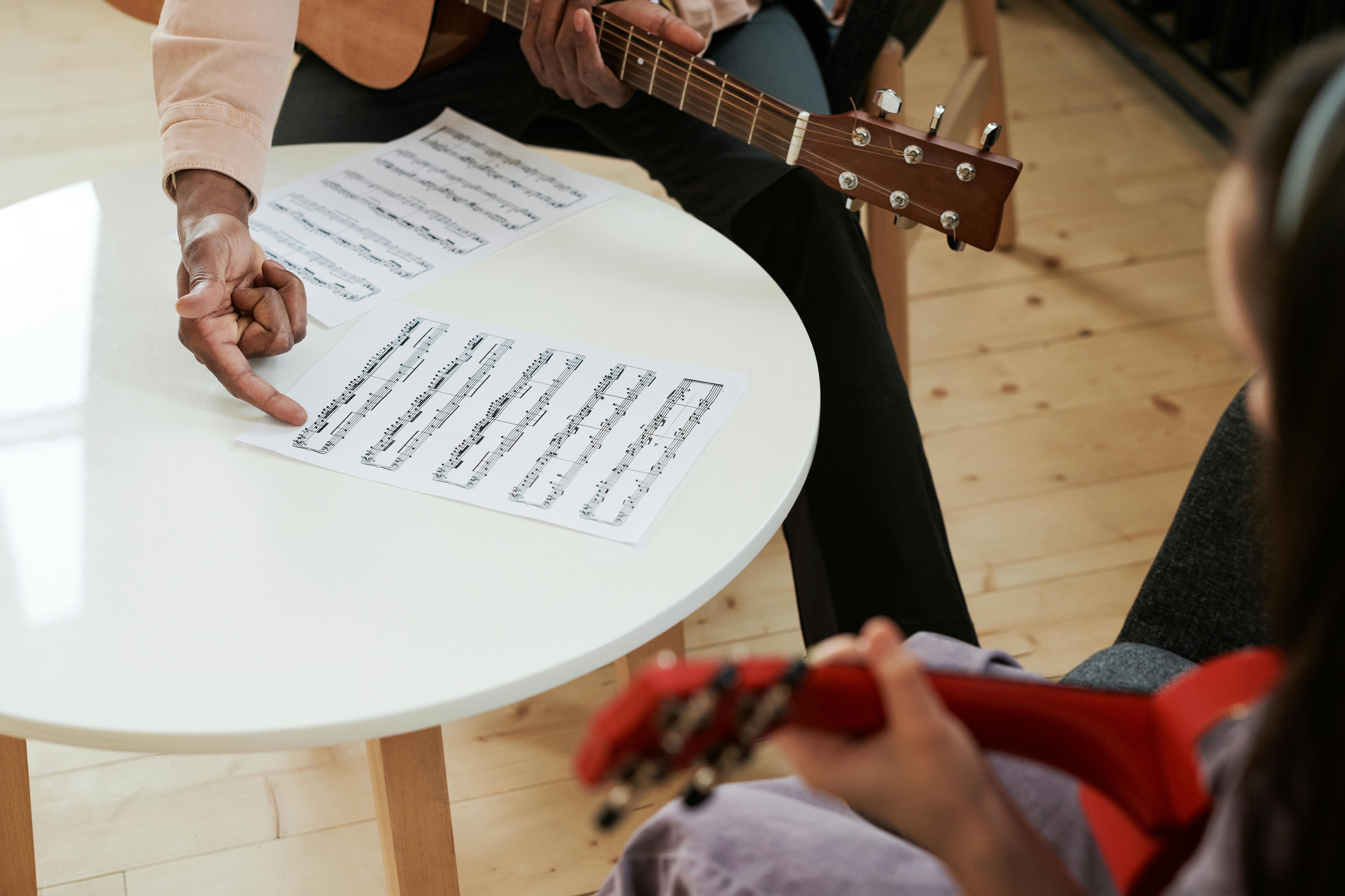 Music Sheet on Round White Table · Free Stock Photo