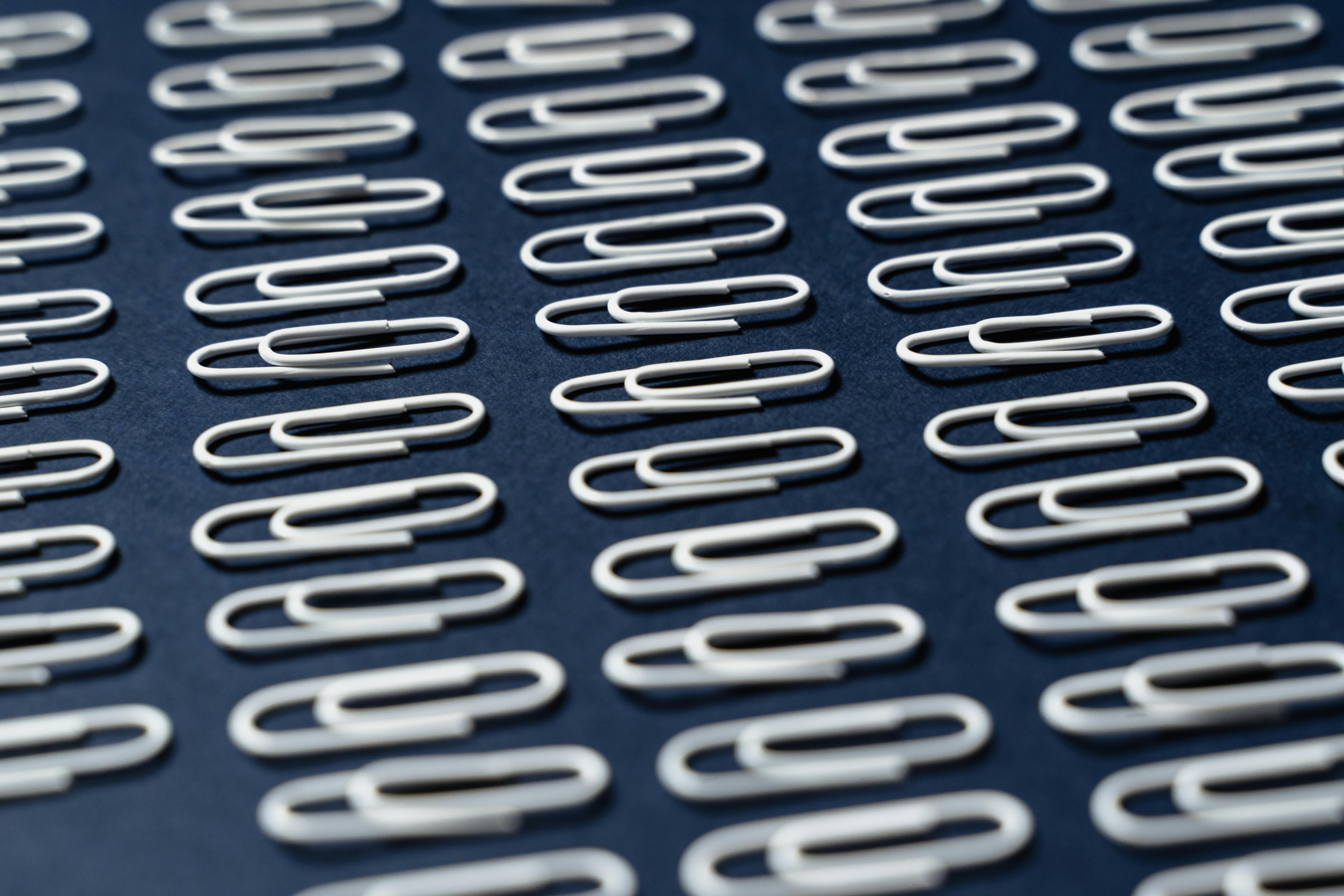 White Paper Clips in Rows · Free Stock Photo