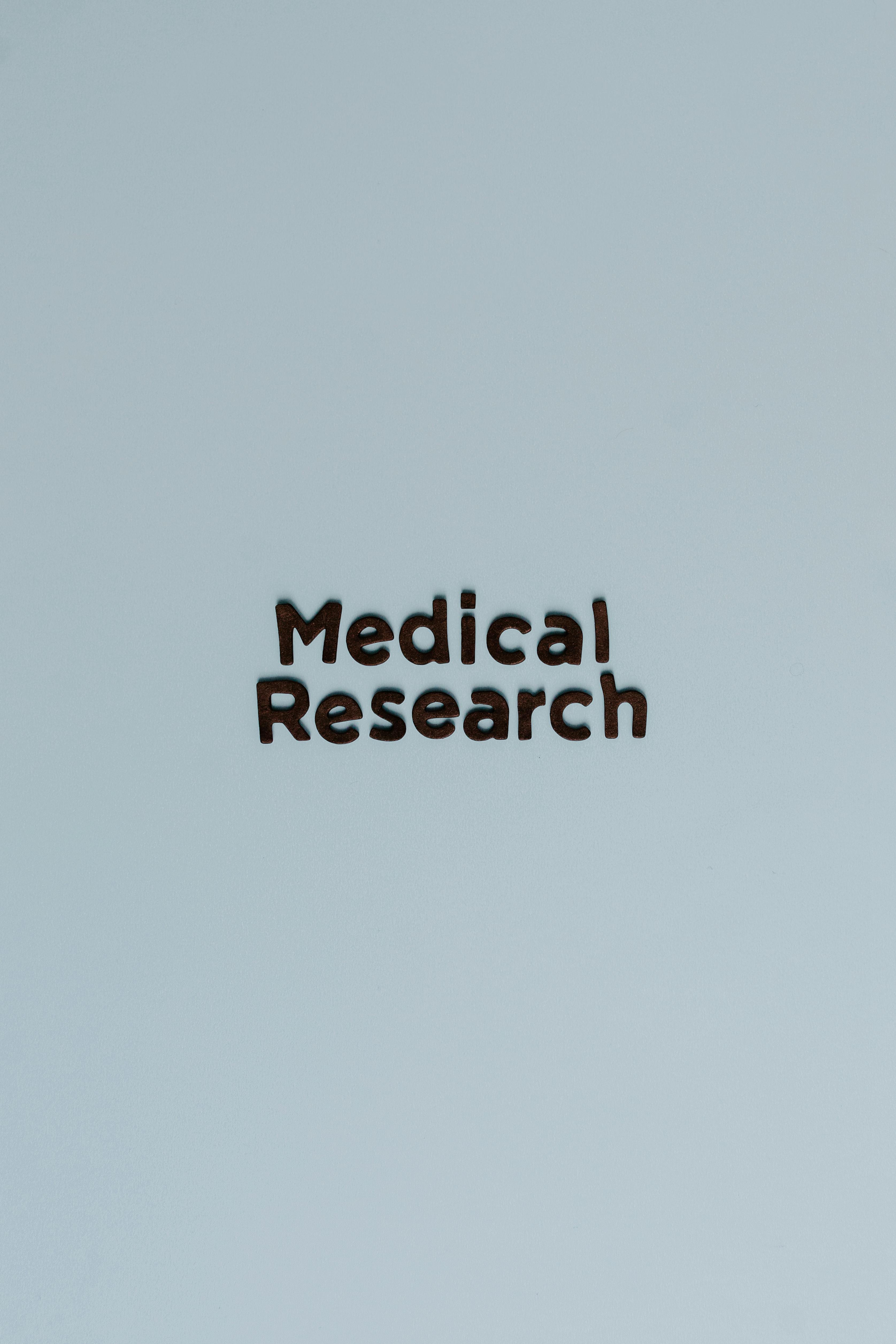 Medical Research Text On Blue Background · Free Stock Photo