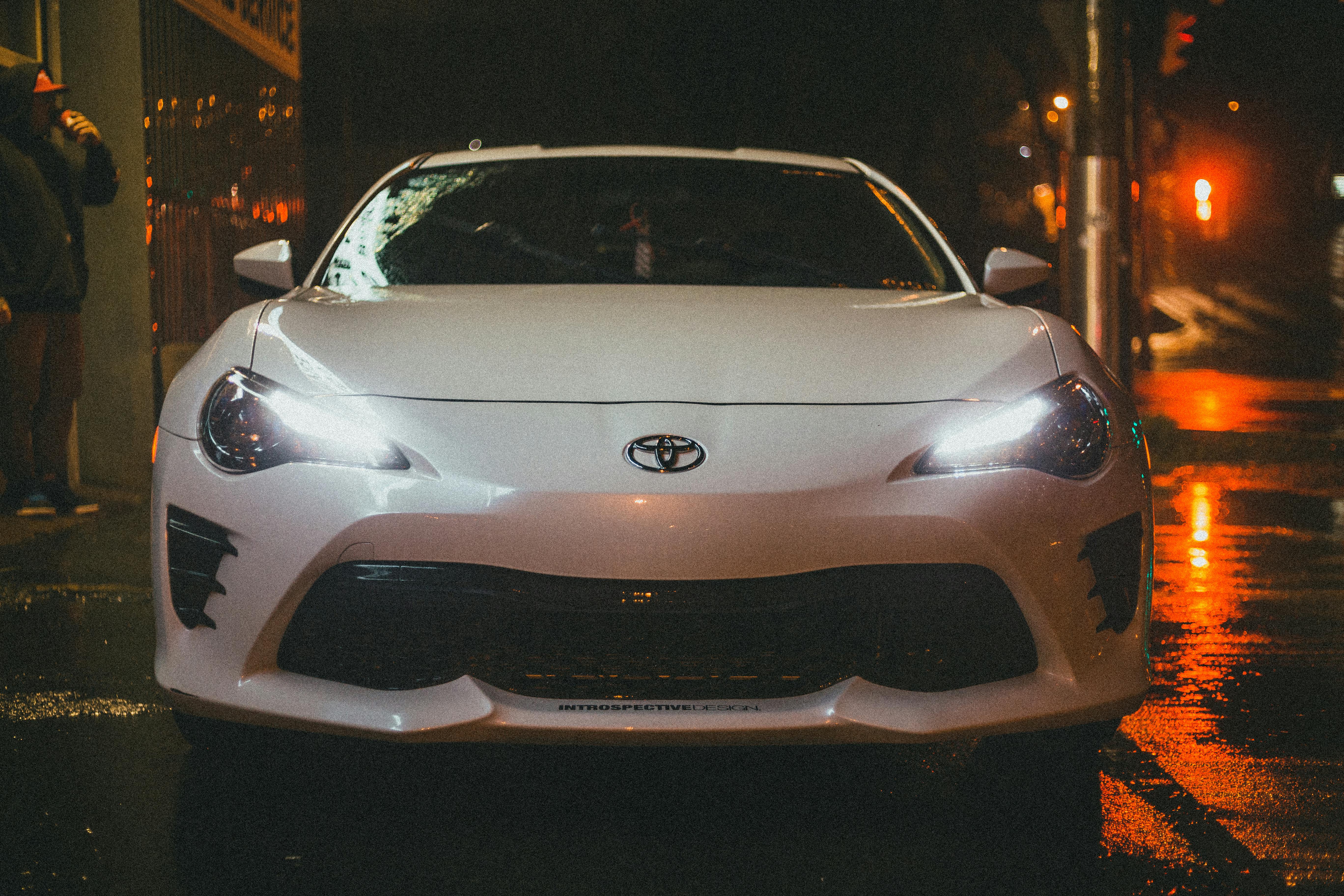 A White Toyota Car Parked on Street during Night Time · Free Stock Photo
