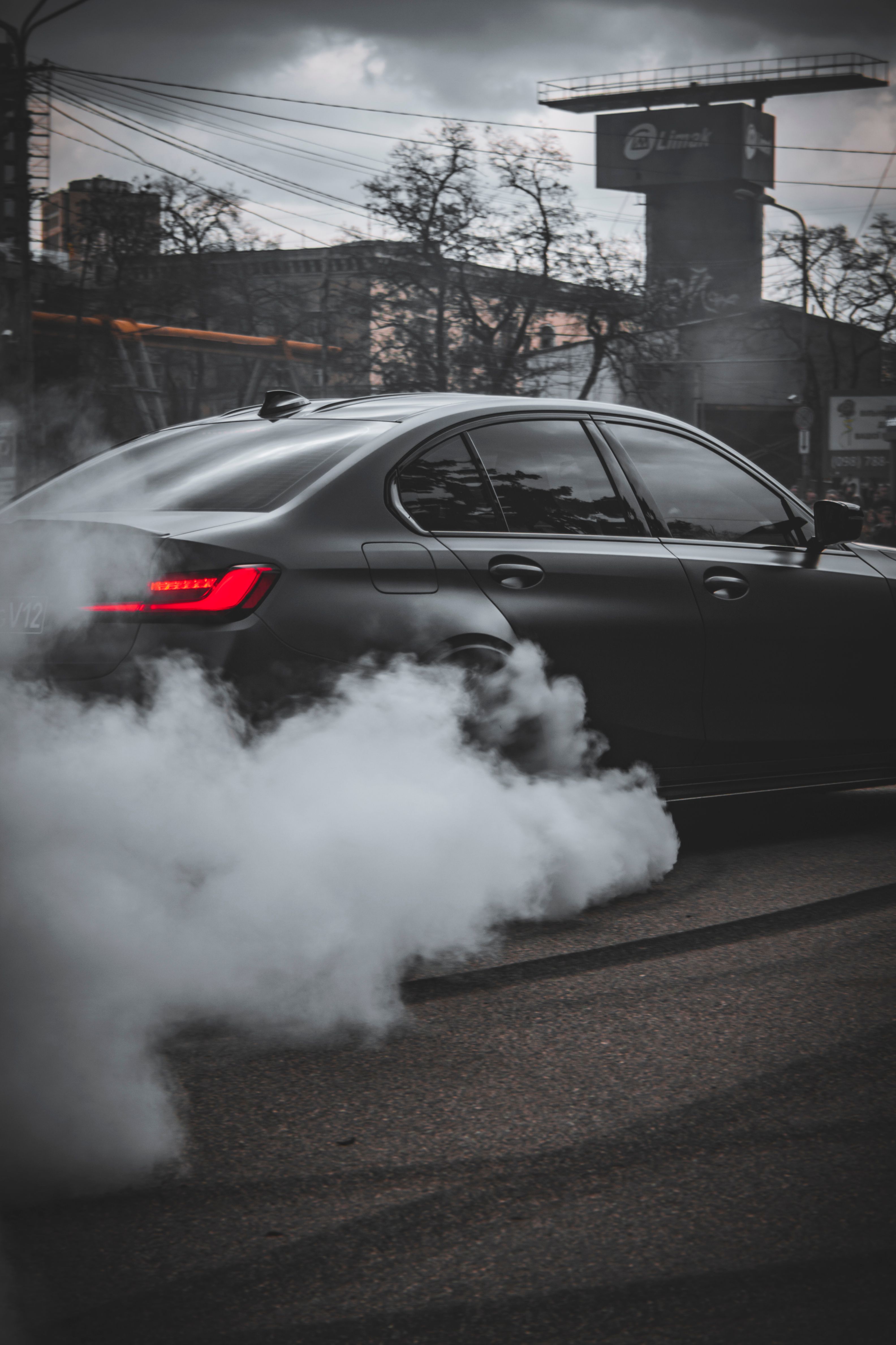 A Red Car Drifting on a Race Track · Free Stock Photo