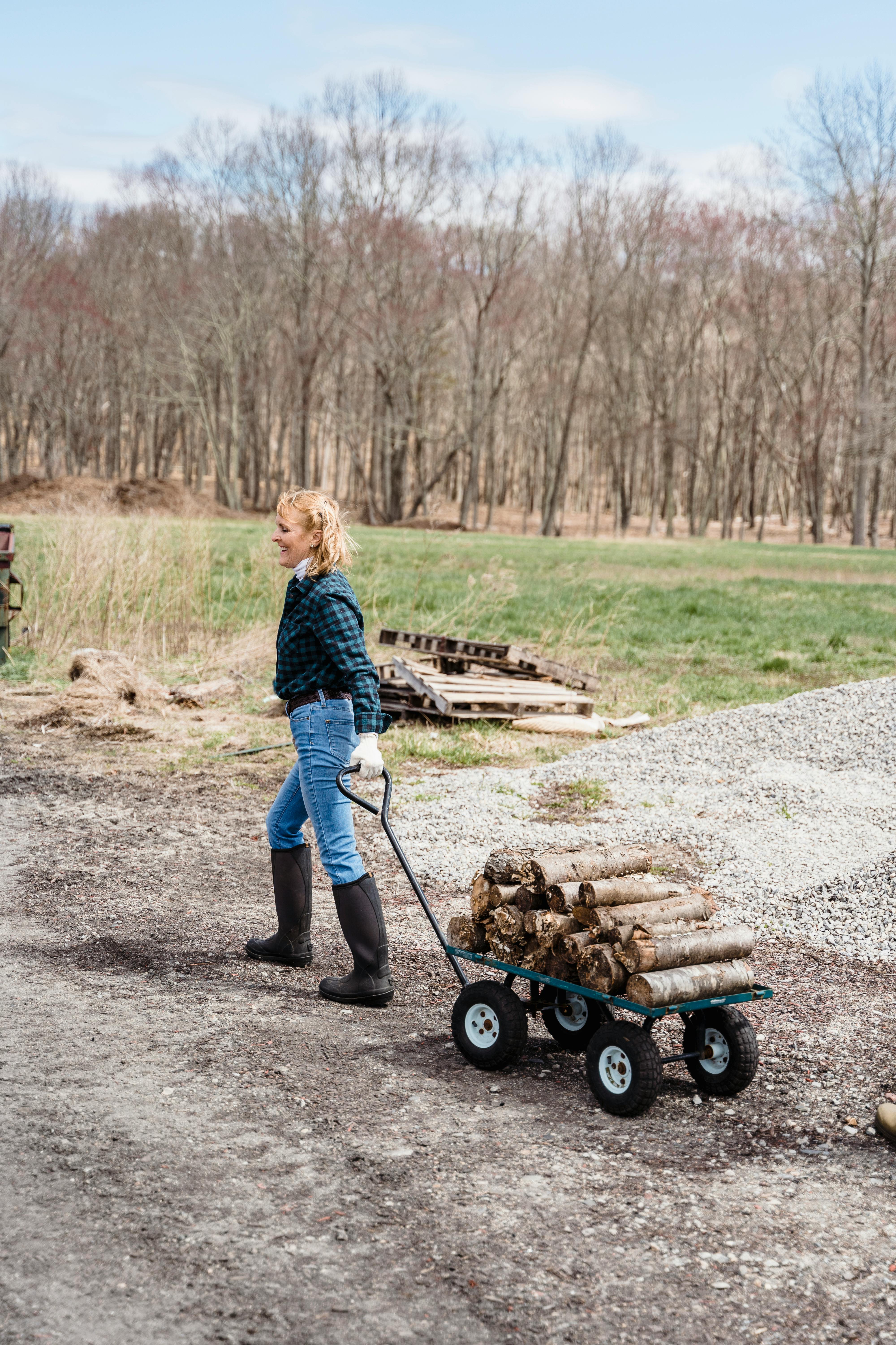 A Woman Pulling a Trolley · Free Stock Photo