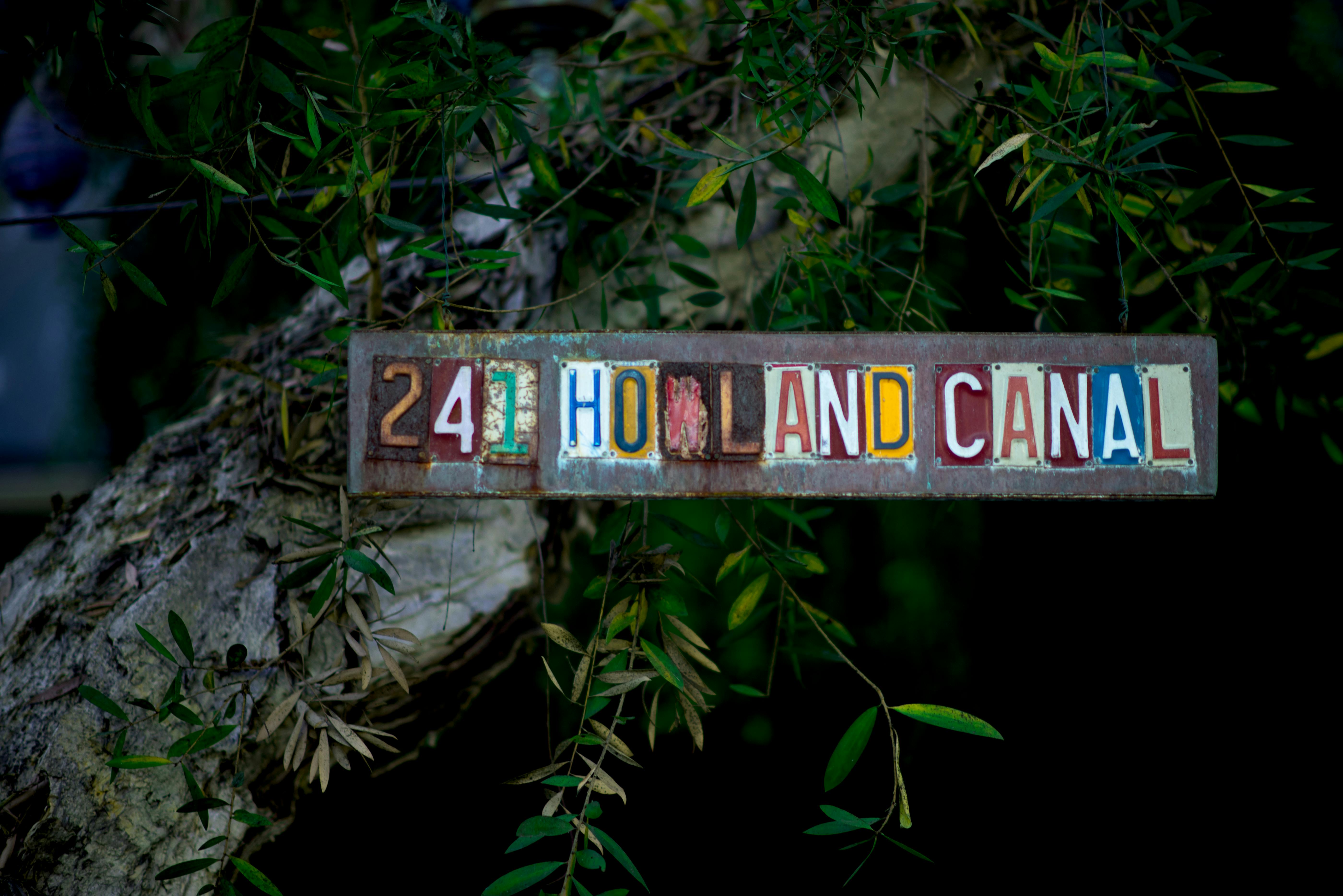 Multi-colored 241 Holland Canal Signage Mounted on Rock · Free Stock Photo